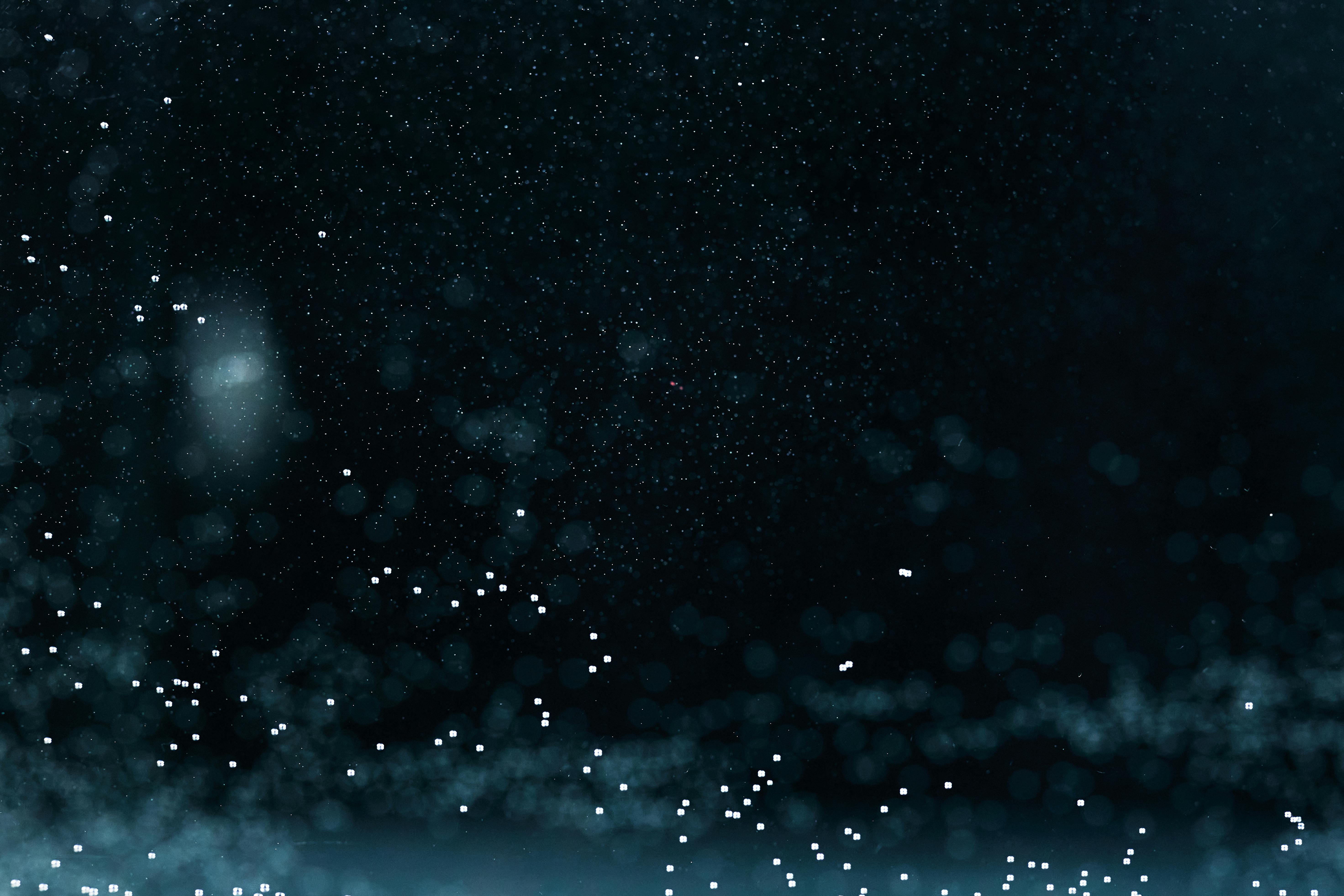 Tiny White Dust Particles on Black Background · Free Stock Photo