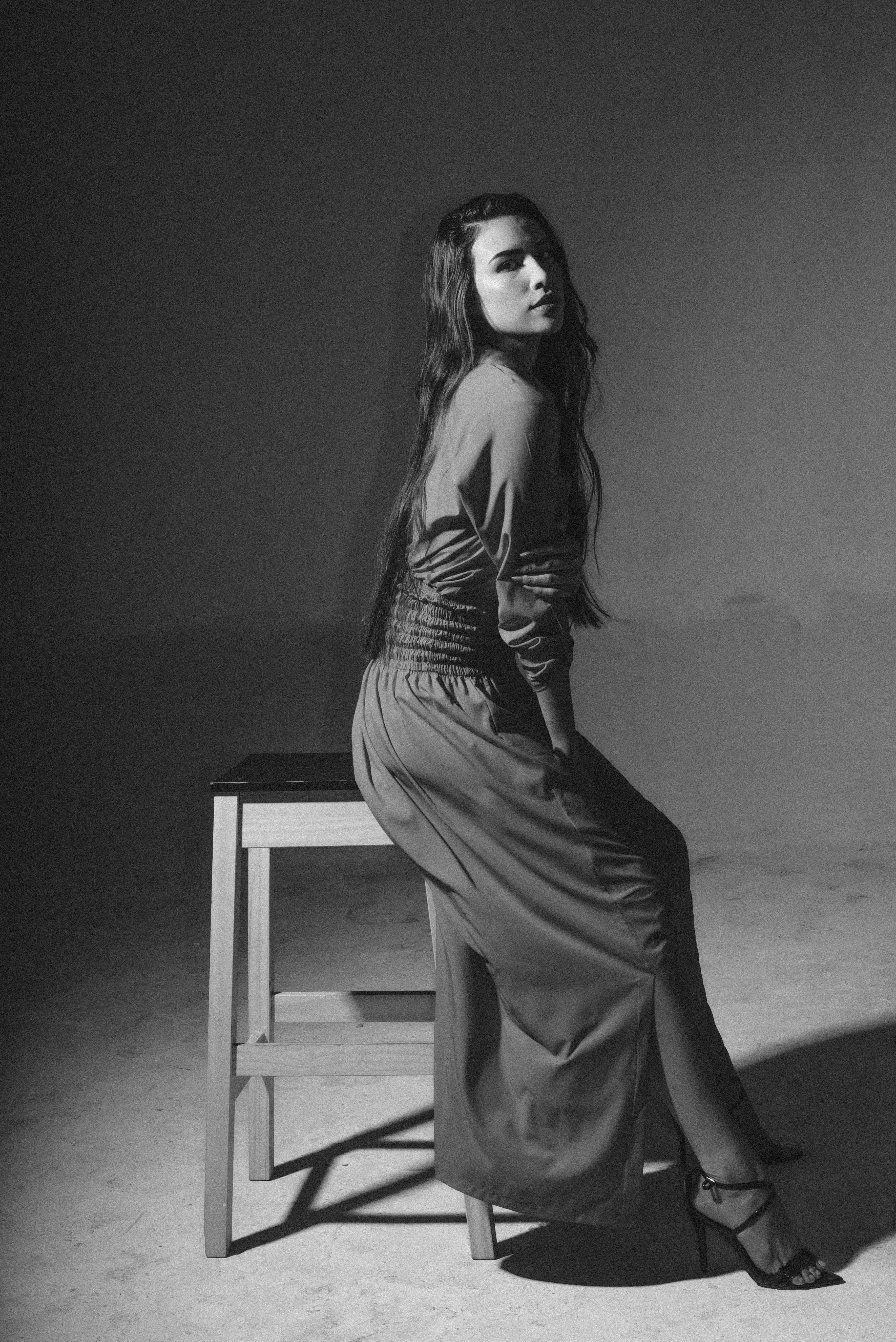 Woman Wearing a Dress Sitting on a Bar Stool · Free Stock Photo