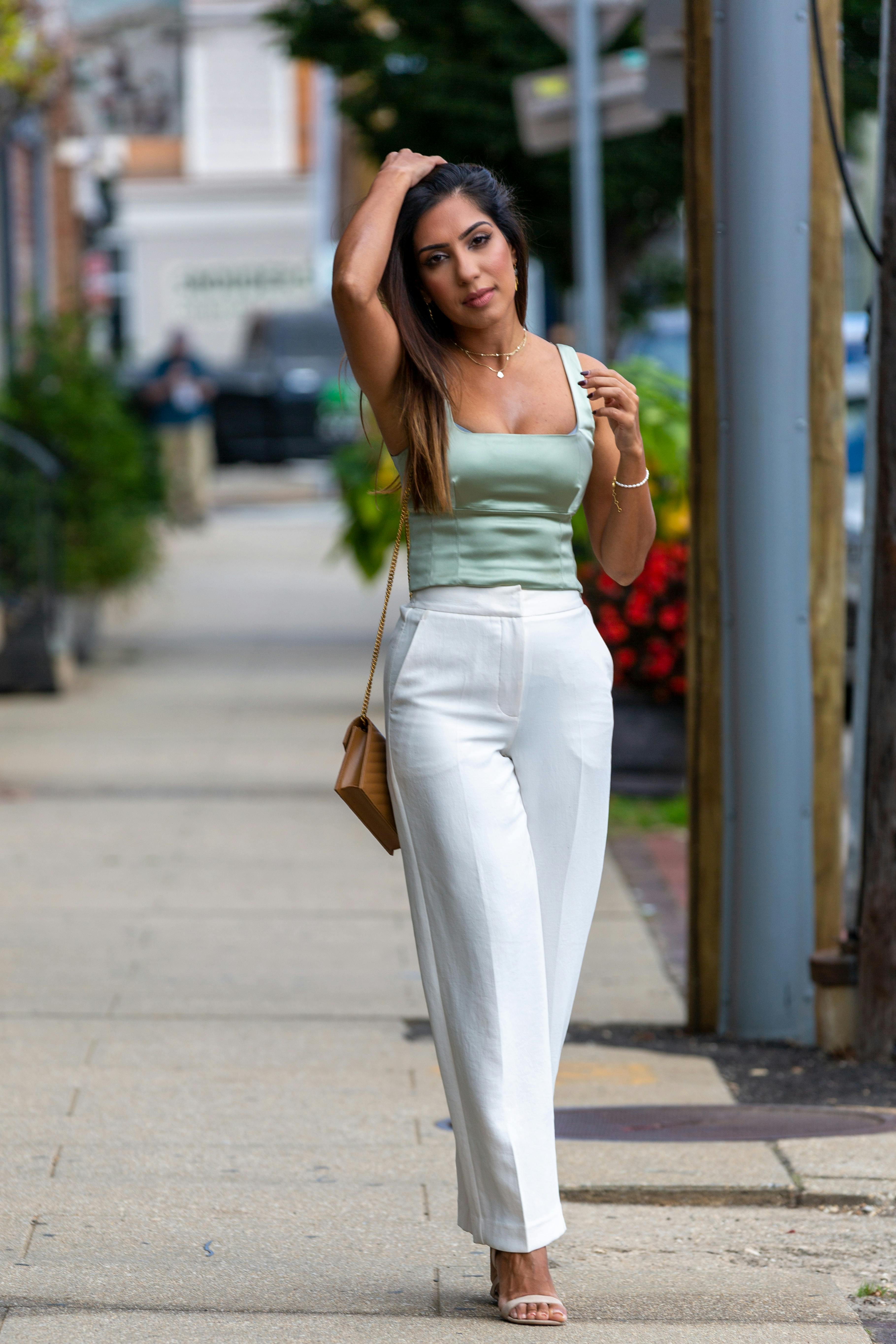 A Woman Walking on the Sidewalk · Free Stock Photo