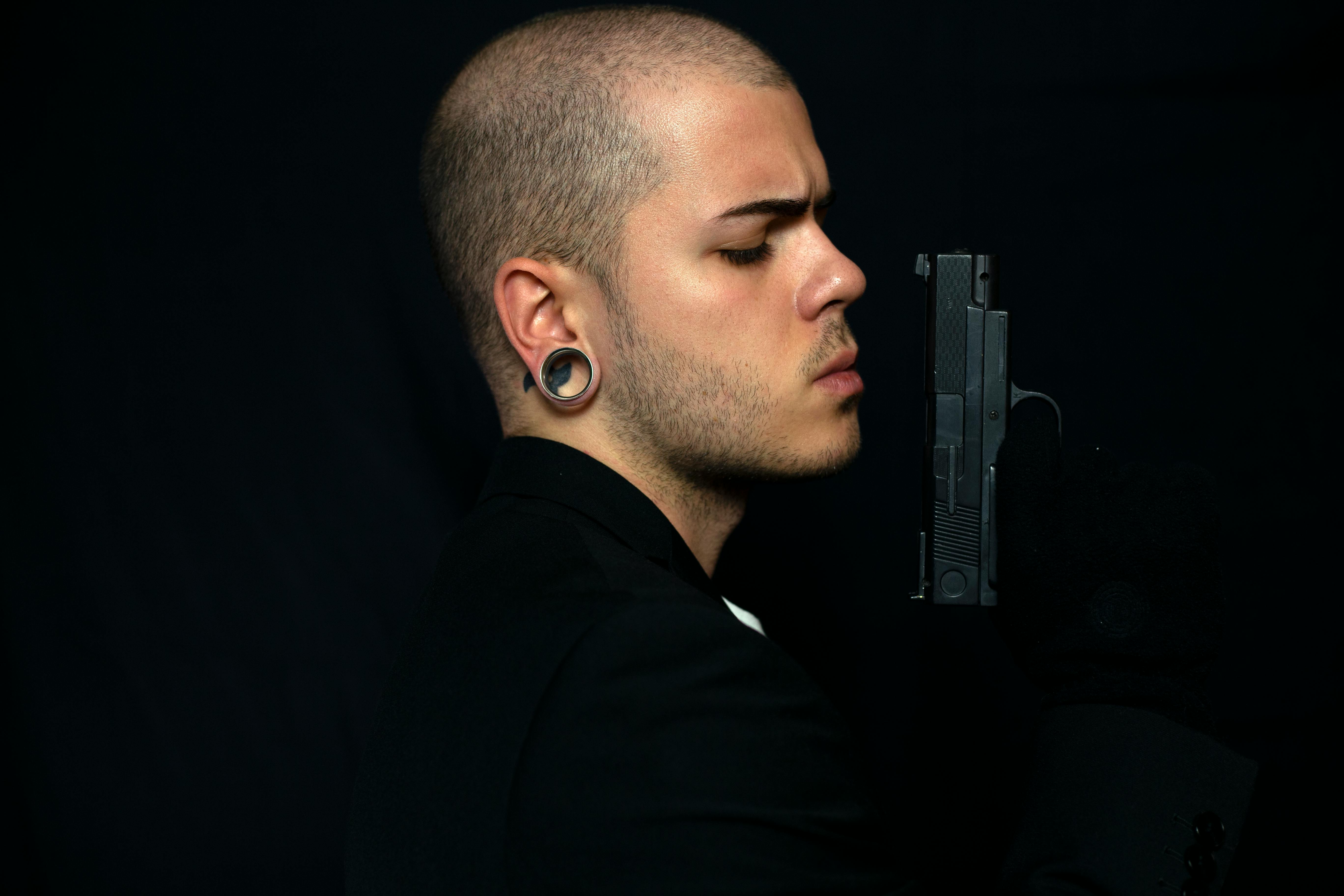 Man Pointing a Gun · Free Stock Photo