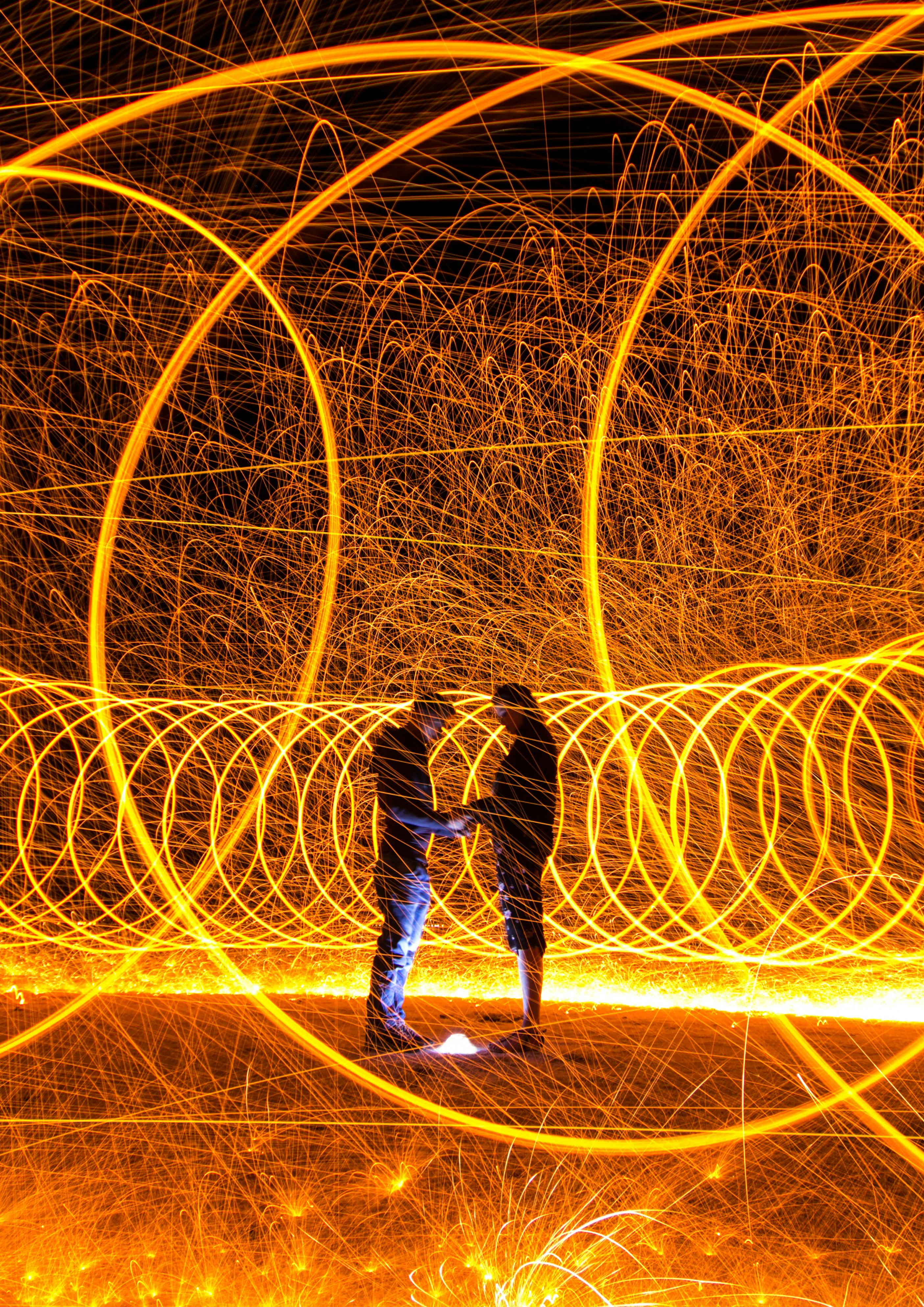 Circles of Lights around People at Night · Free Stock Photo