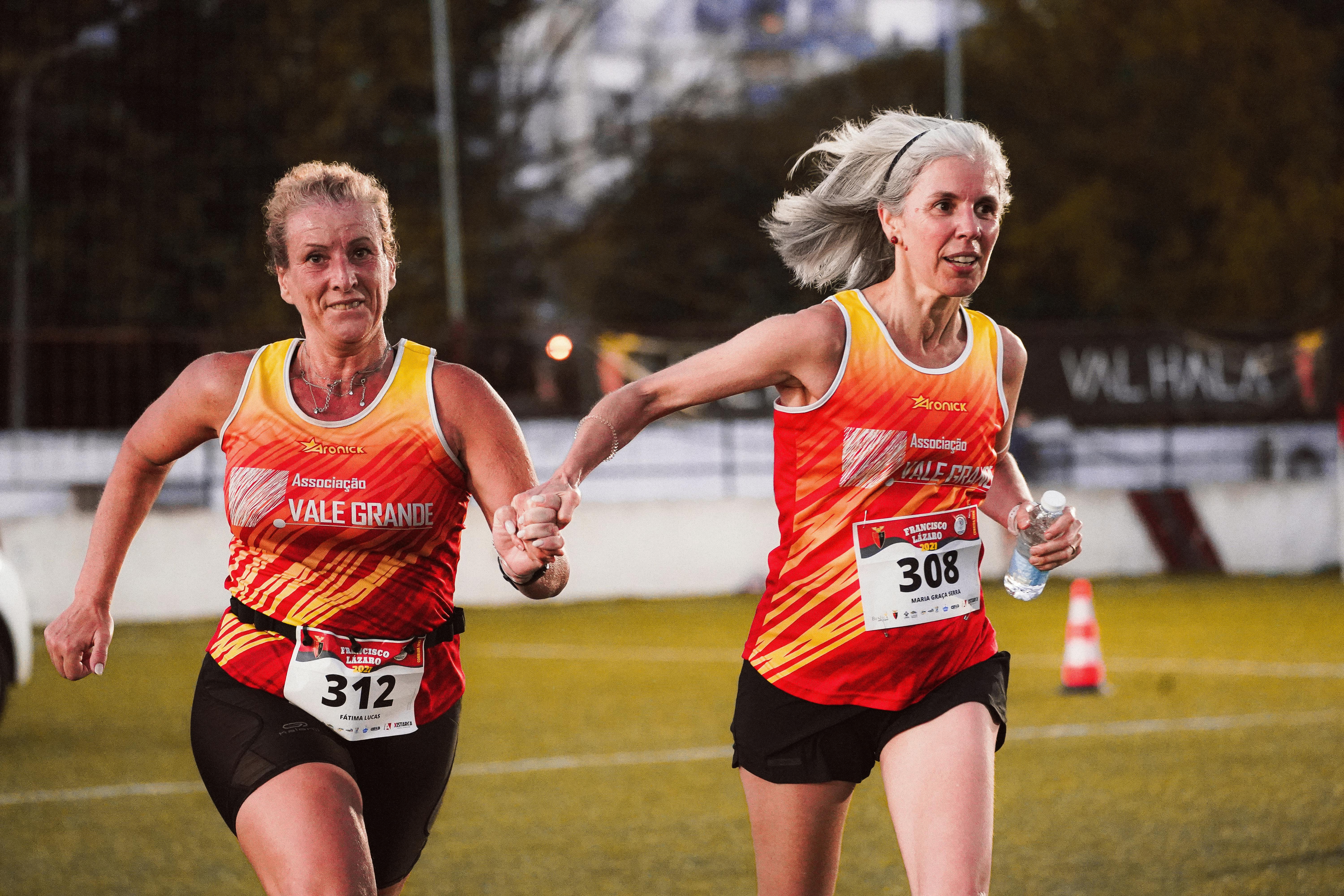 Women Running on the Field · Free Stock Photo