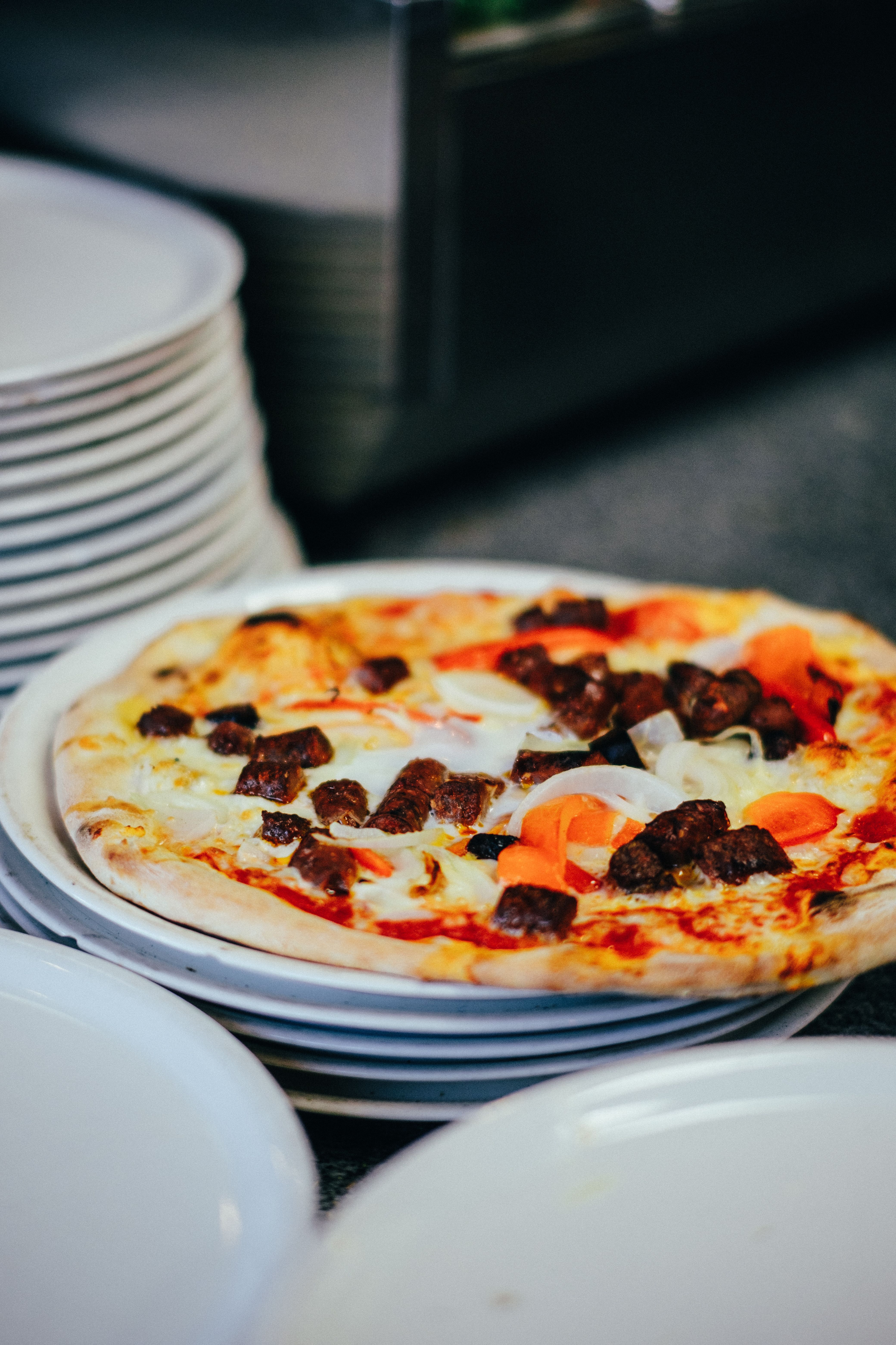 Delicious Pizza on White Ceramic Plate · Free Stock Photo