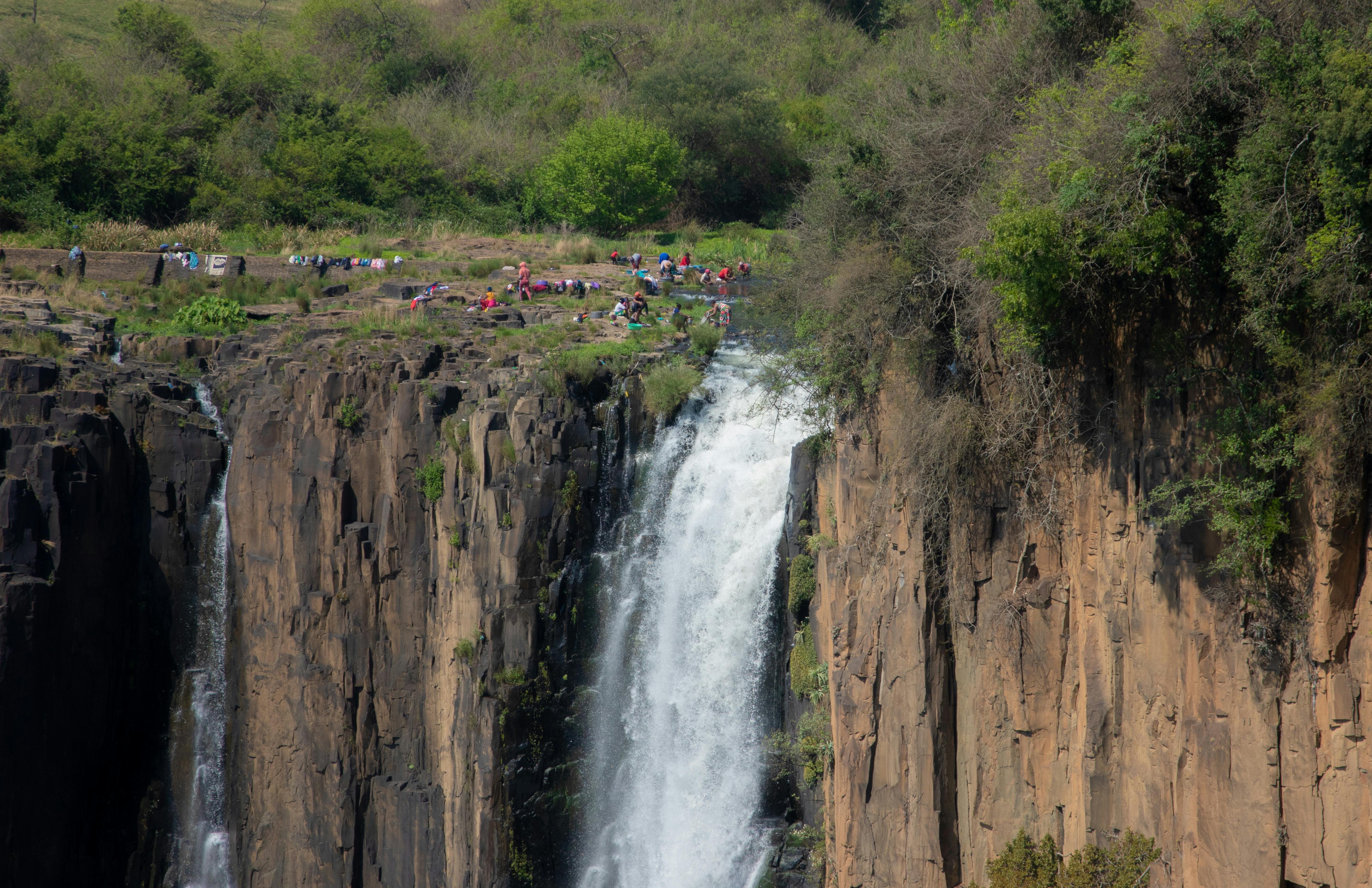 A Group of People Near the Waterfall · Free Stock Photo