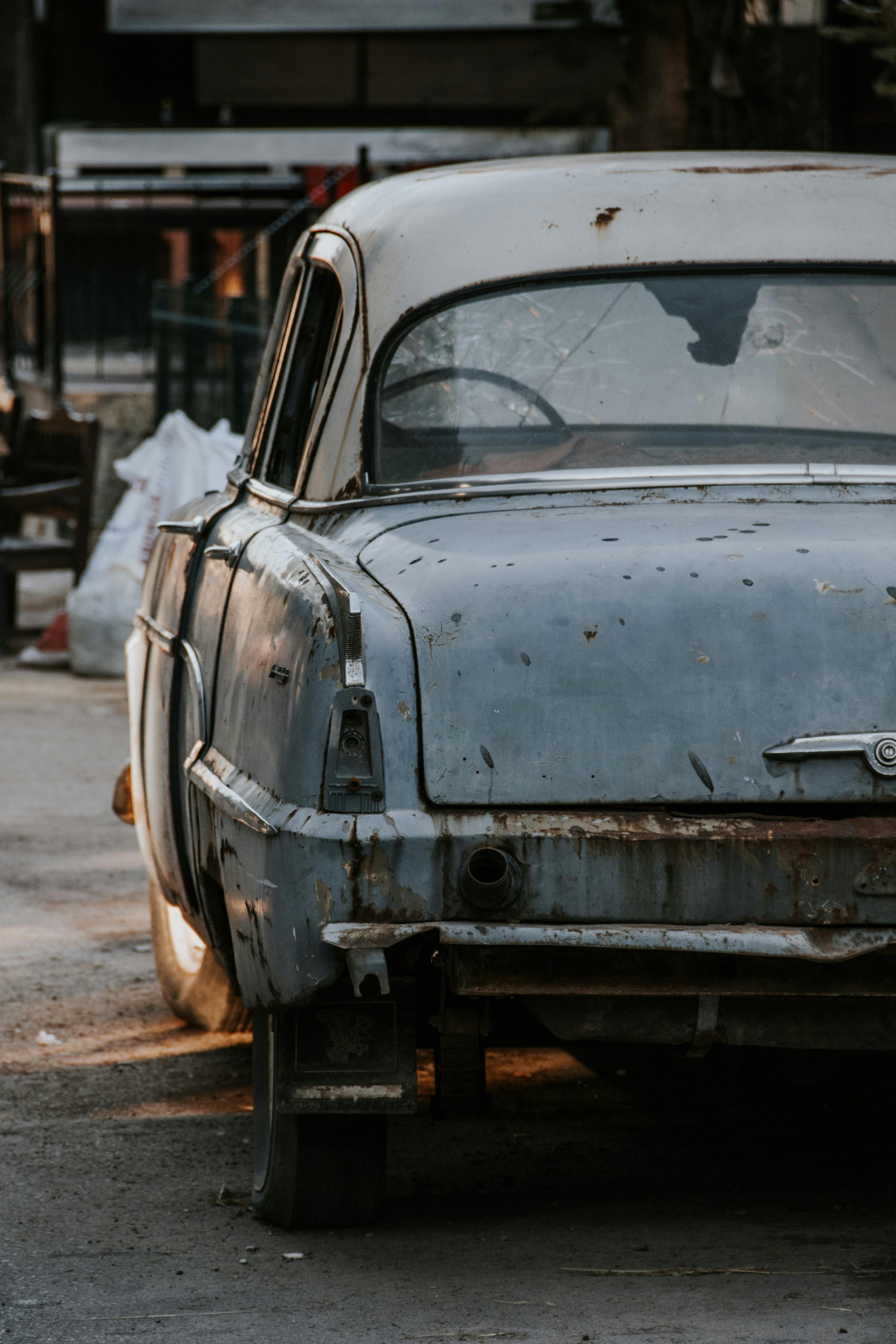 Photo of the Back of an Abandoned Car · Free Stock Photo
