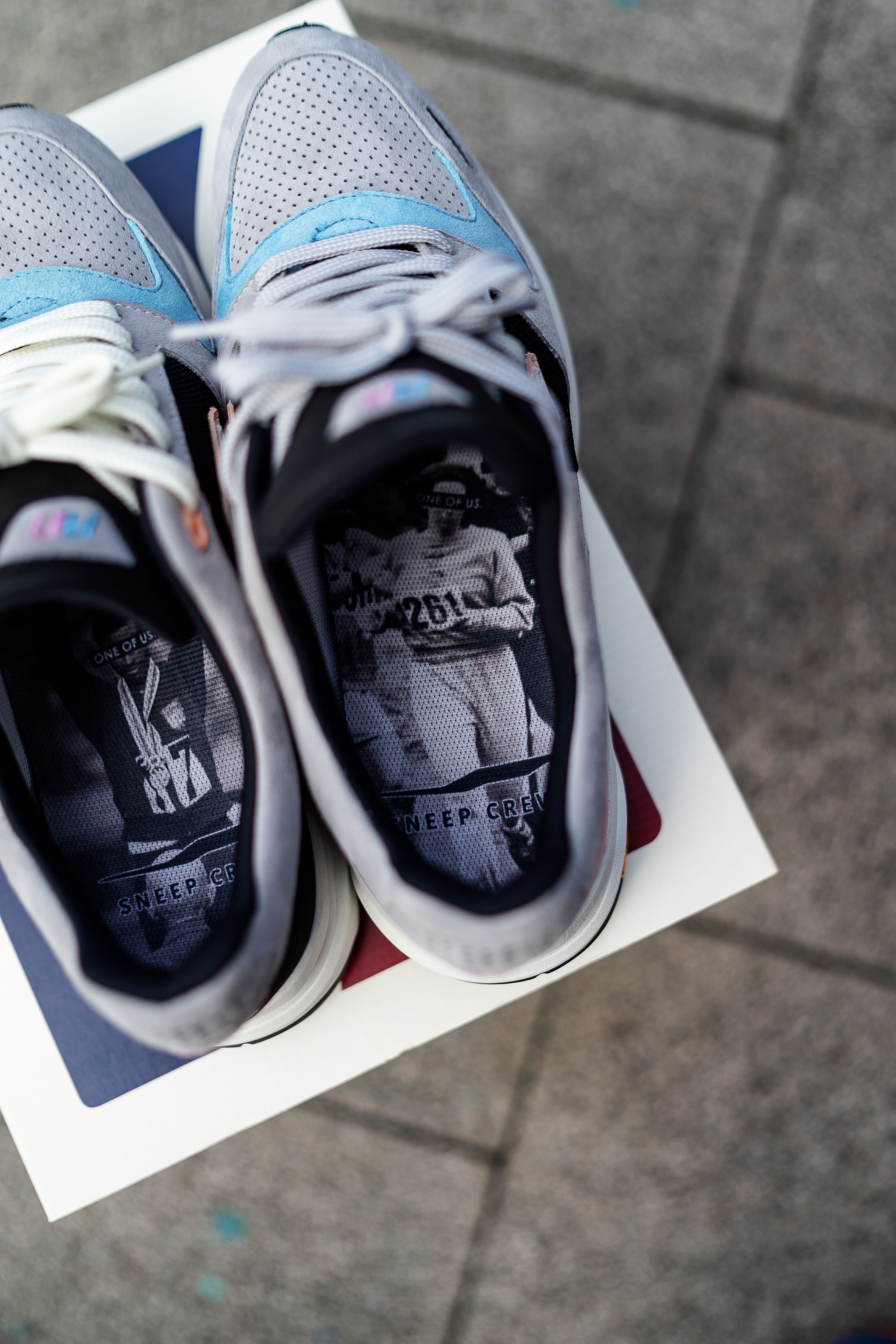 Overhead Shot of Gray and Blue Sneakers · Free Stock Photo