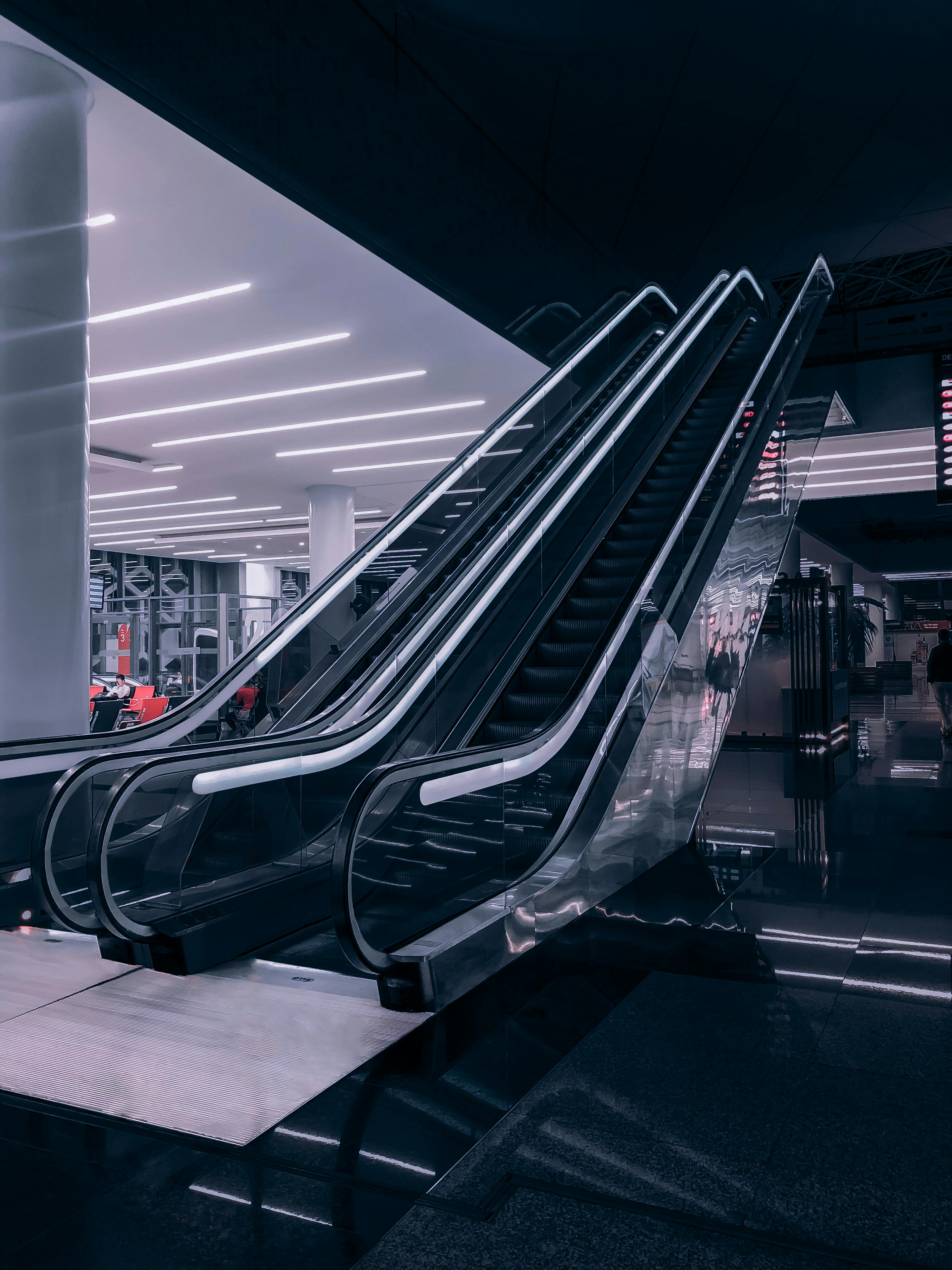 Person on Escalator · Free Stock Photo