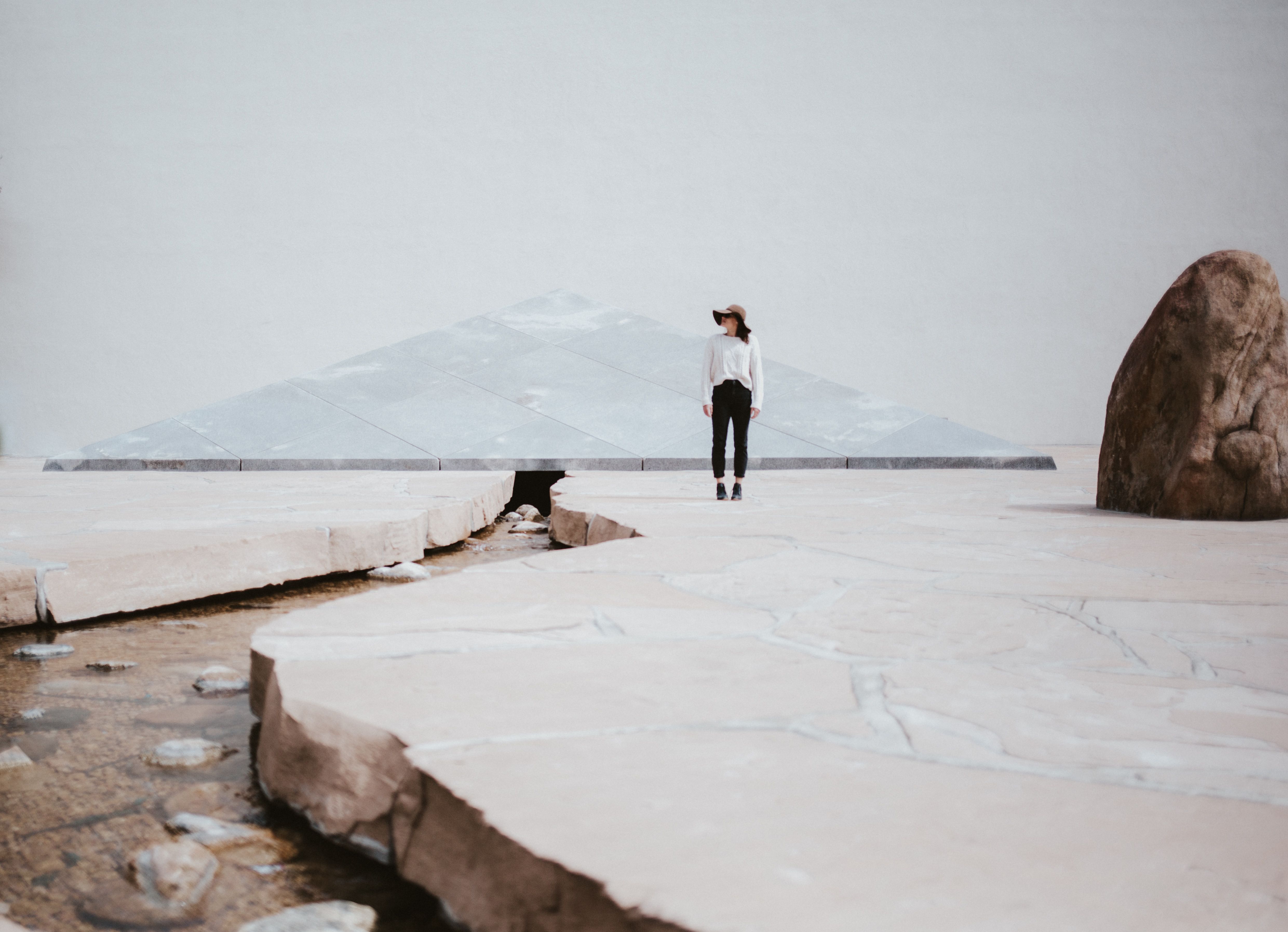 Woman Standing Near Big Rock · Free Stock Photo