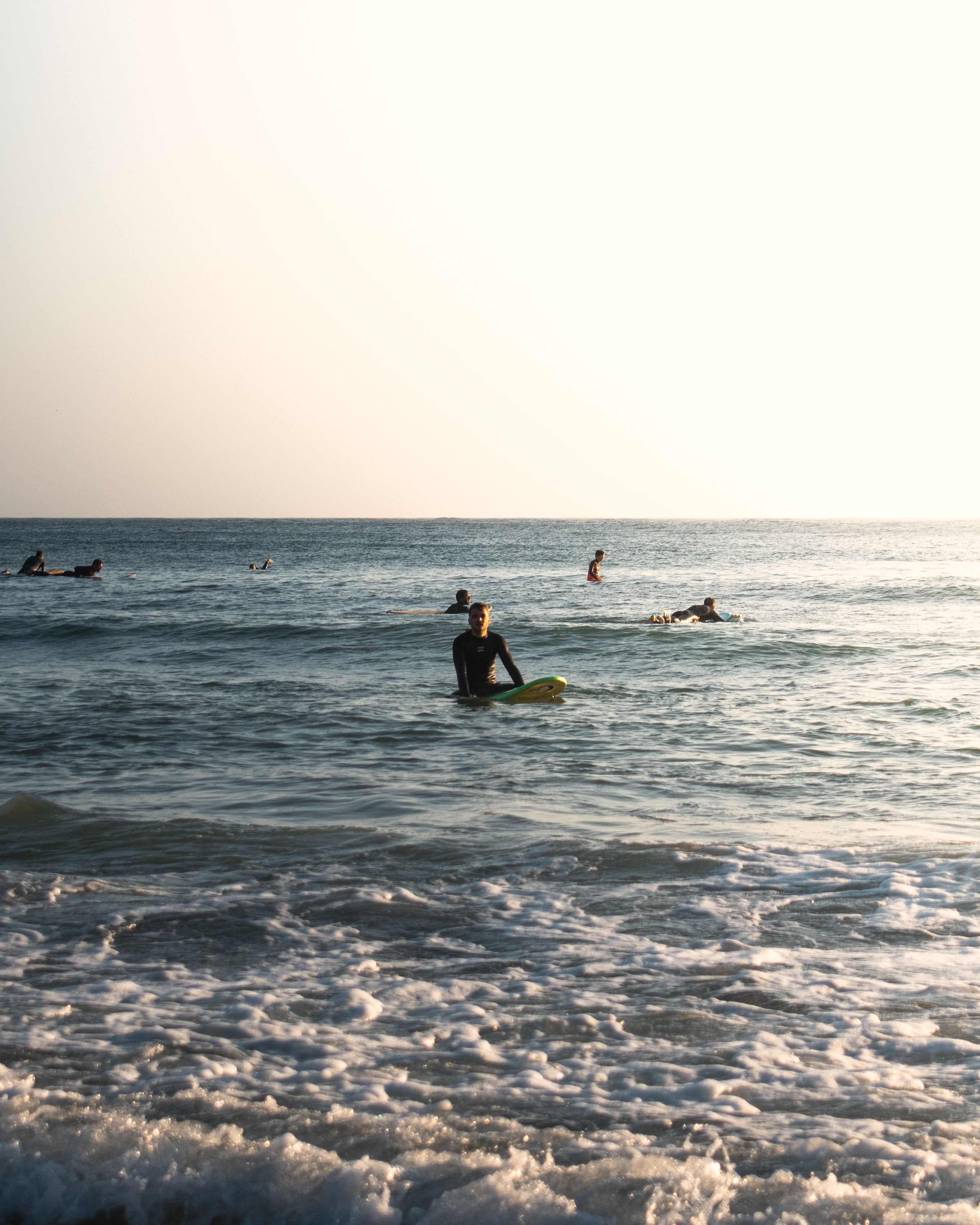 Woman on Surfboard Swimming in Water · Free Stock Photo