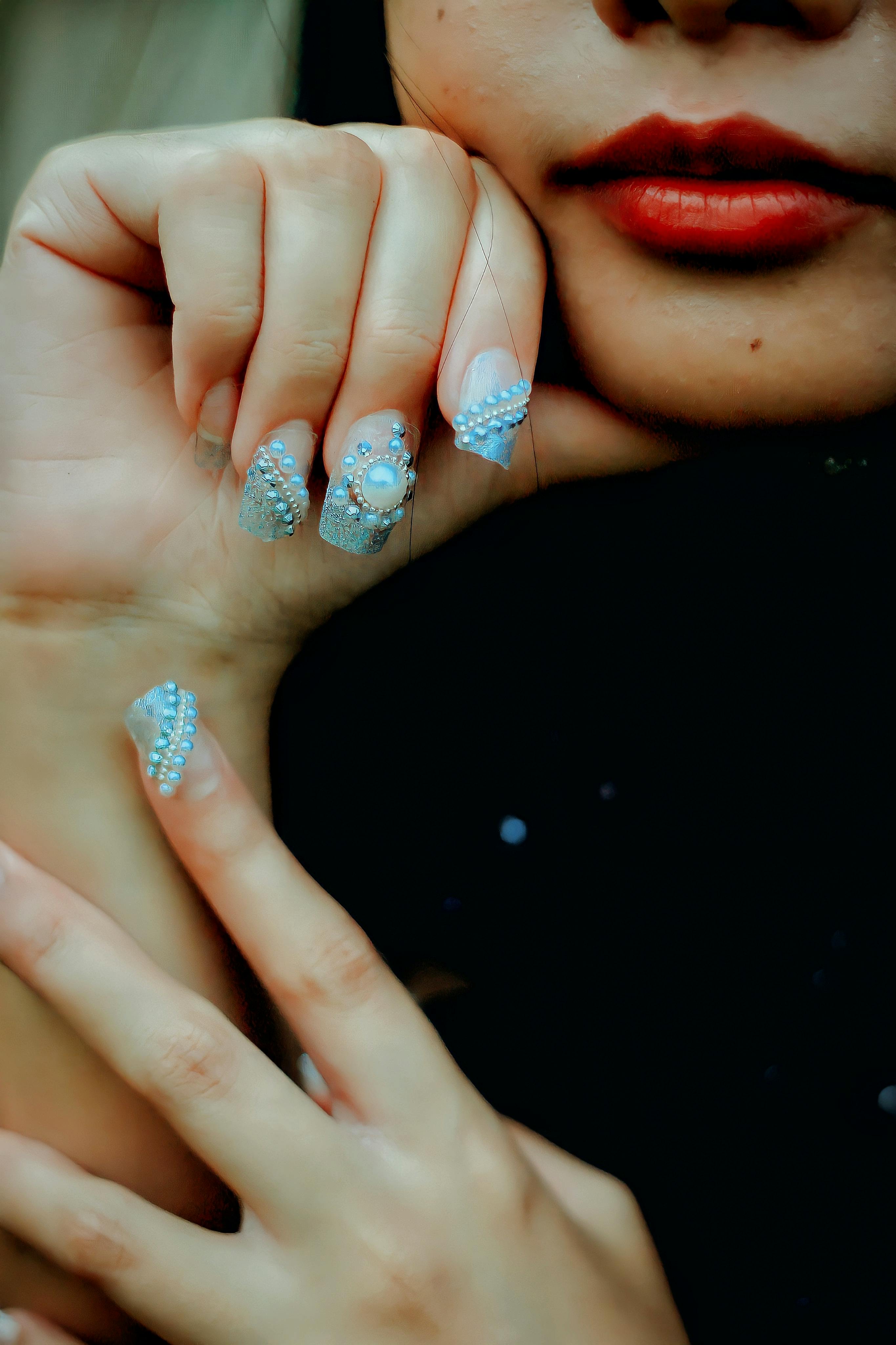 Hand Holding a Graduation Cap · Free Stock Photo