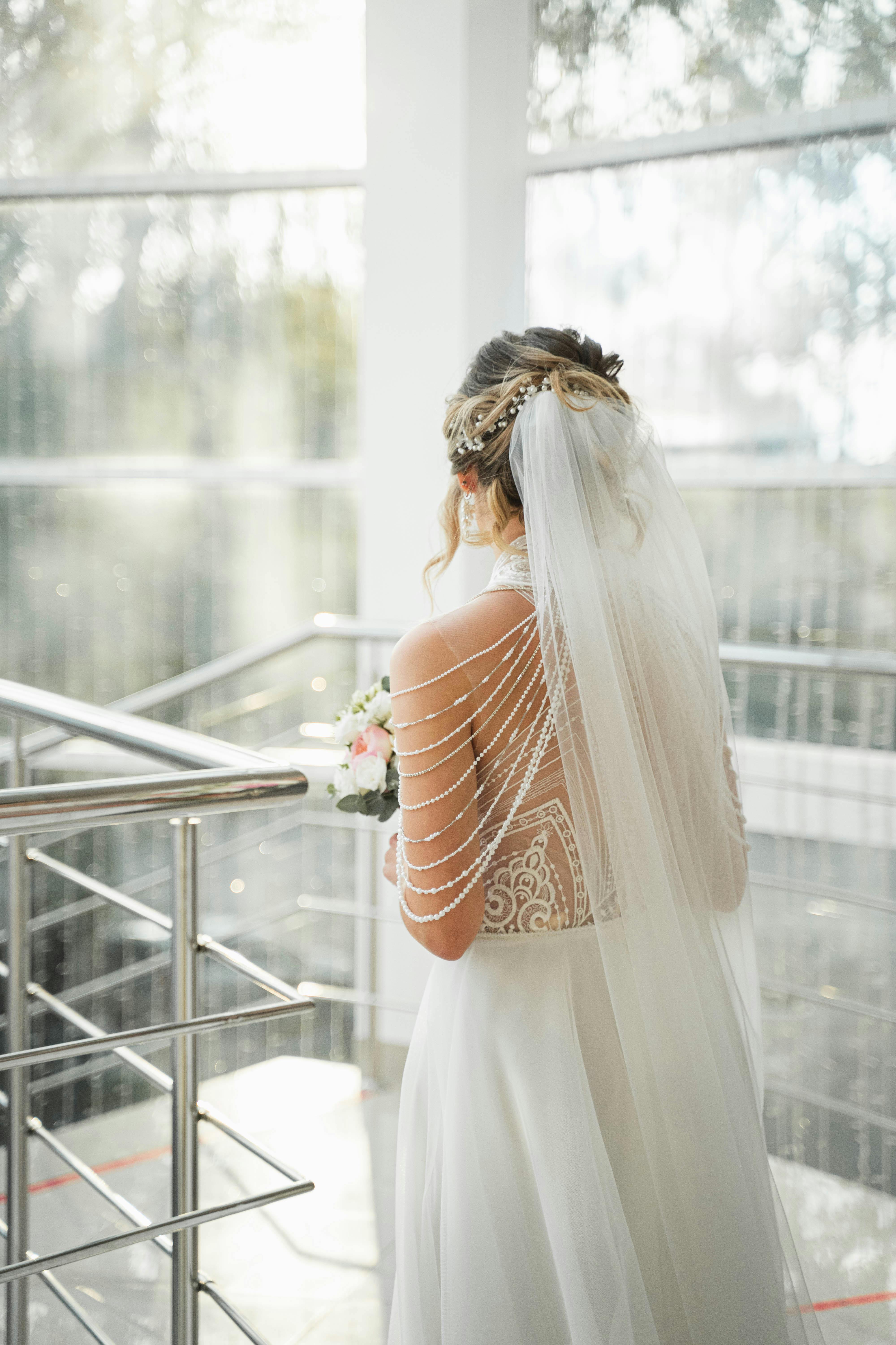 Back View of Bride Running Down the Stairs · Free Stock Photo