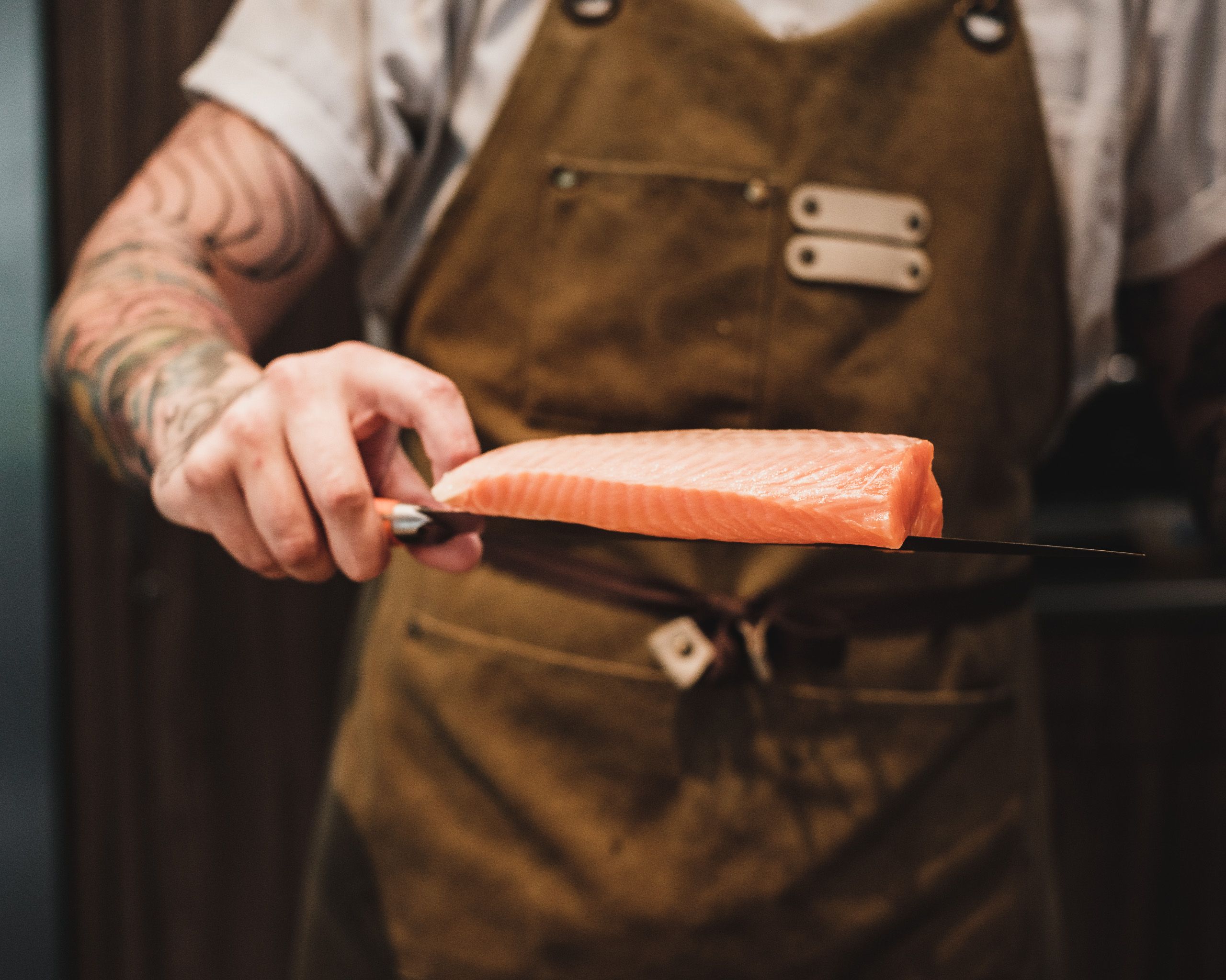 Person Holding Raw Fish · Free Stock Photo