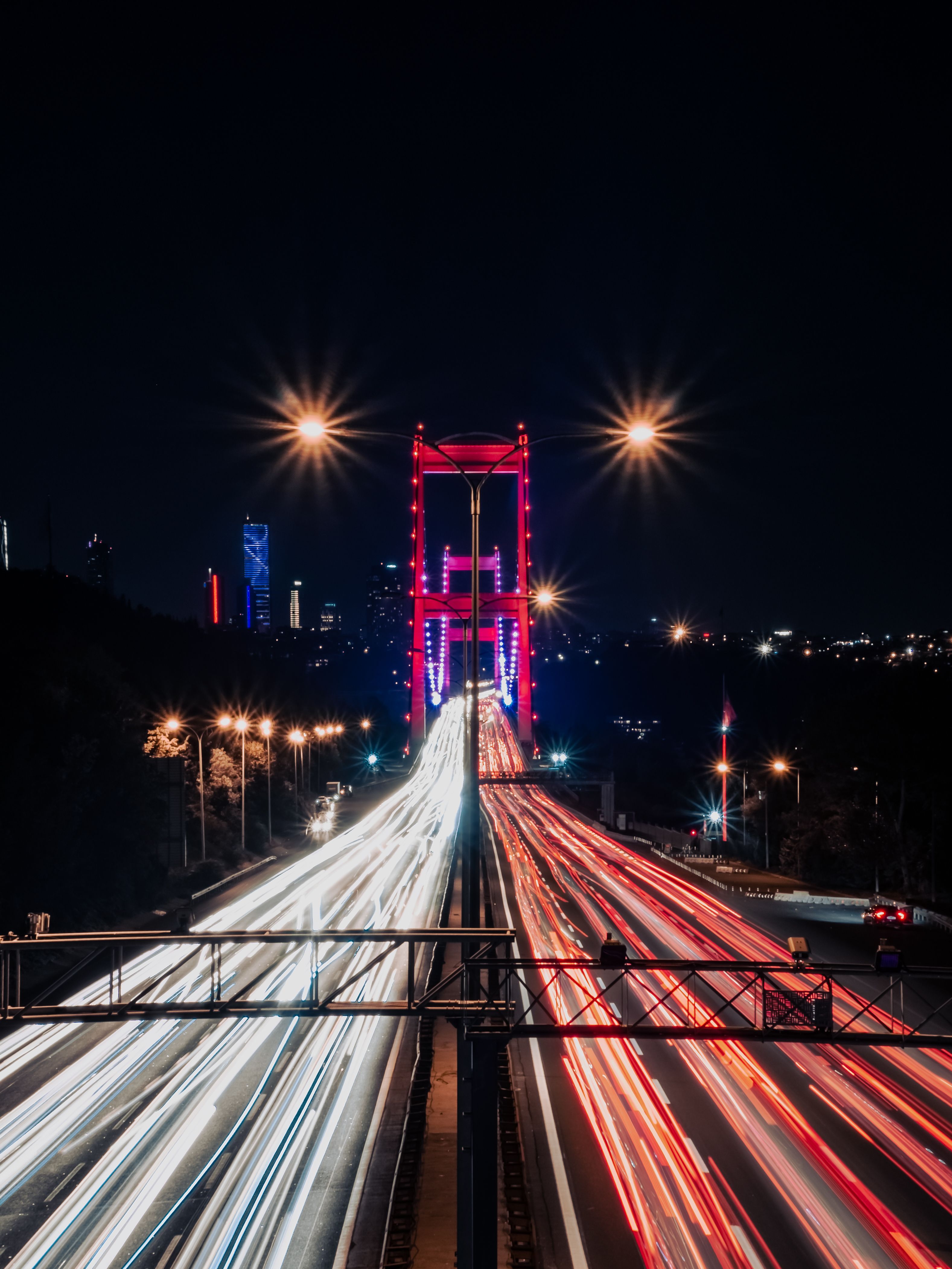 Illuminated Road to Bridge in City · Free Stock Photo