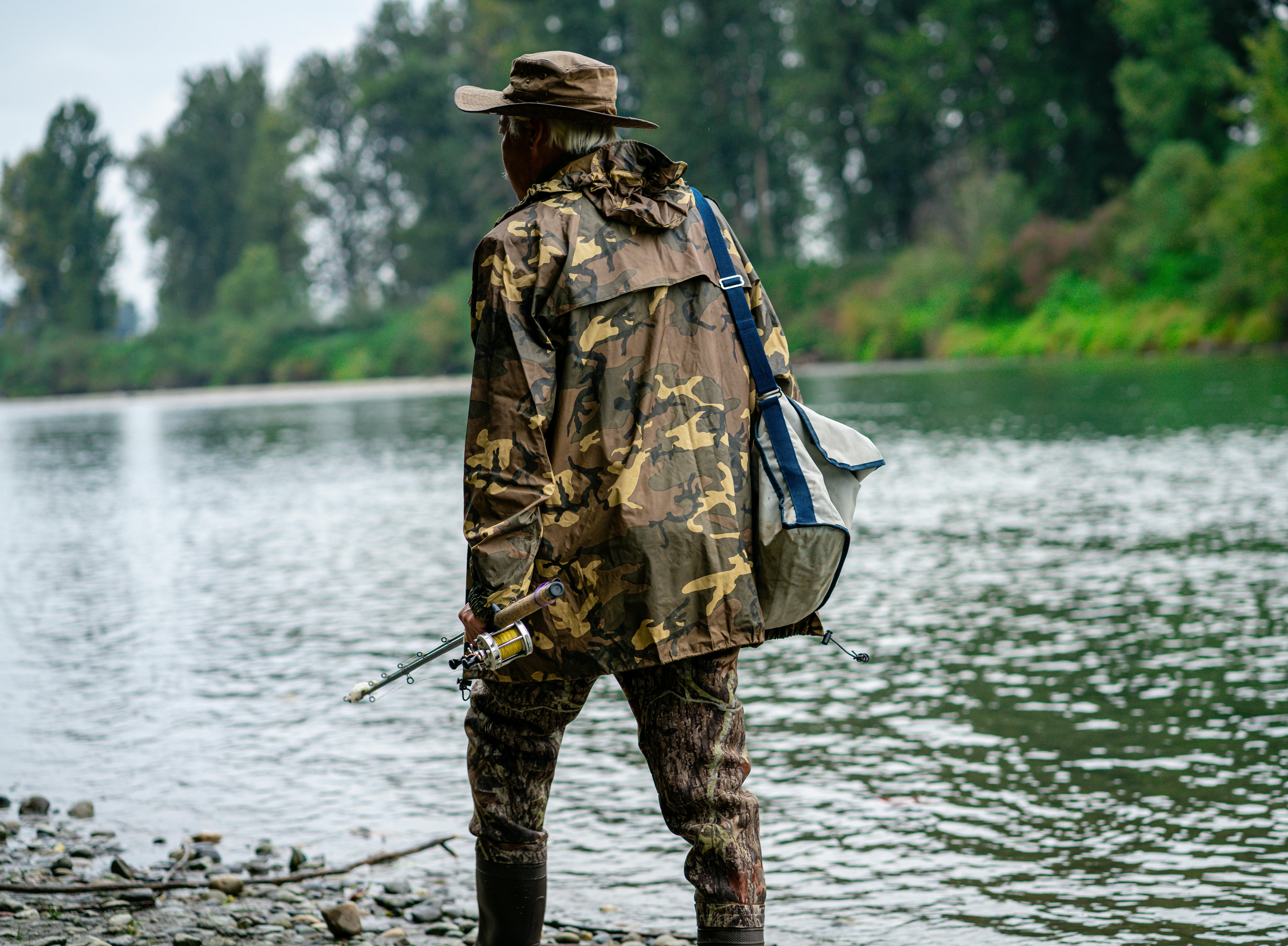 Person on White Boat Fishing on Body of Water · Free Stock Photo