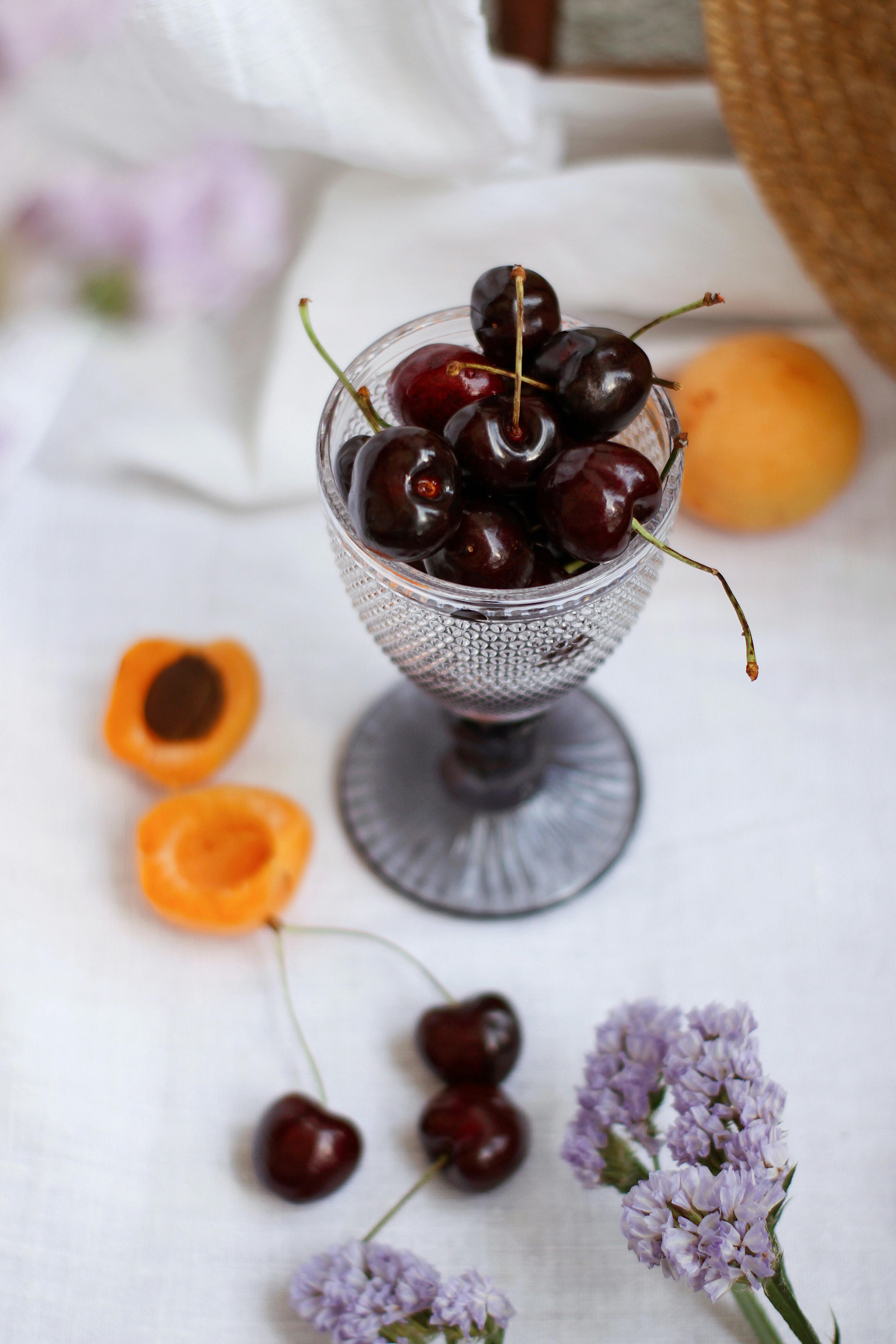 Red Round Fruits on White Surface · Free Stock Photo