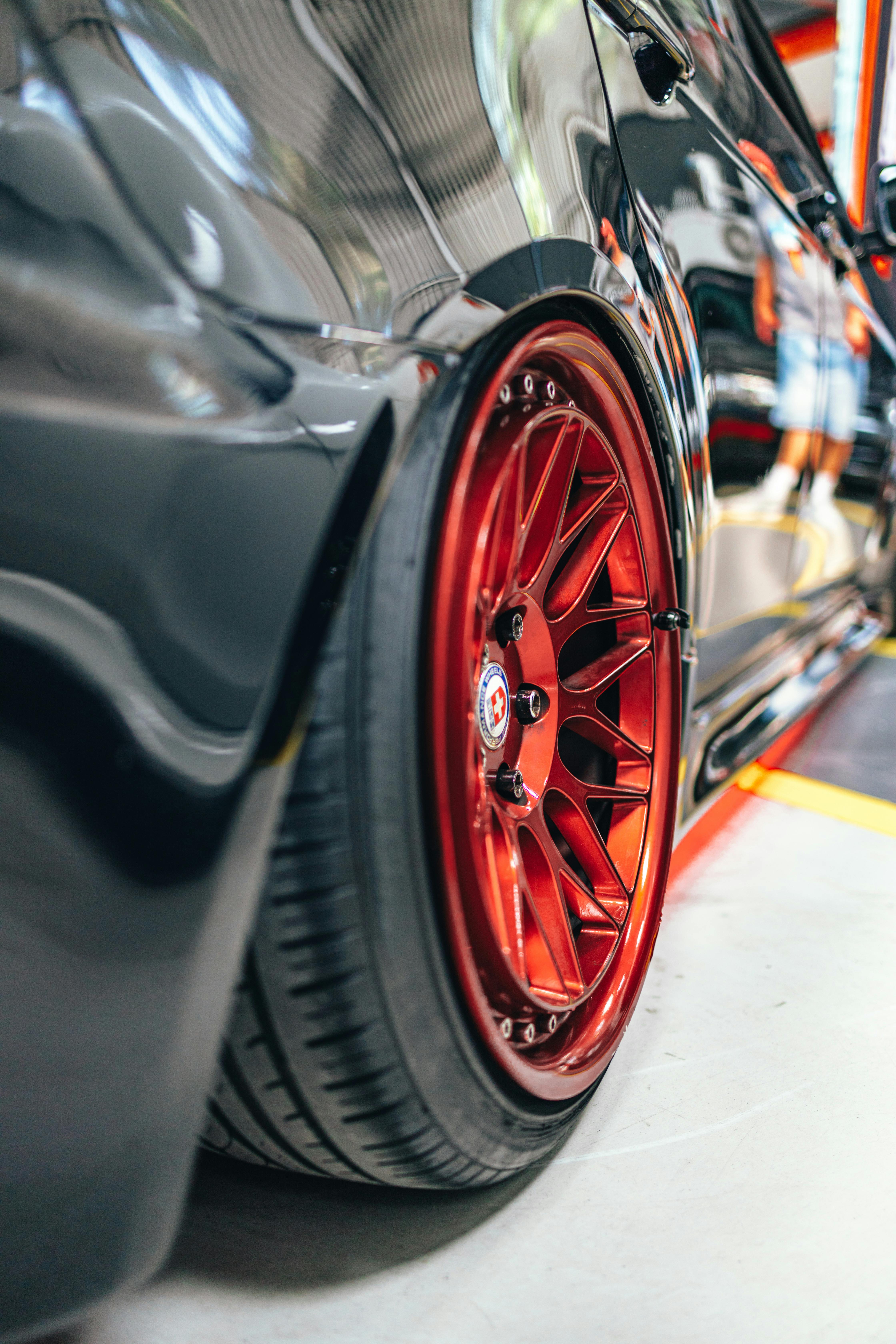 Black and Red Car Wheel on Road · Free Stock Photo