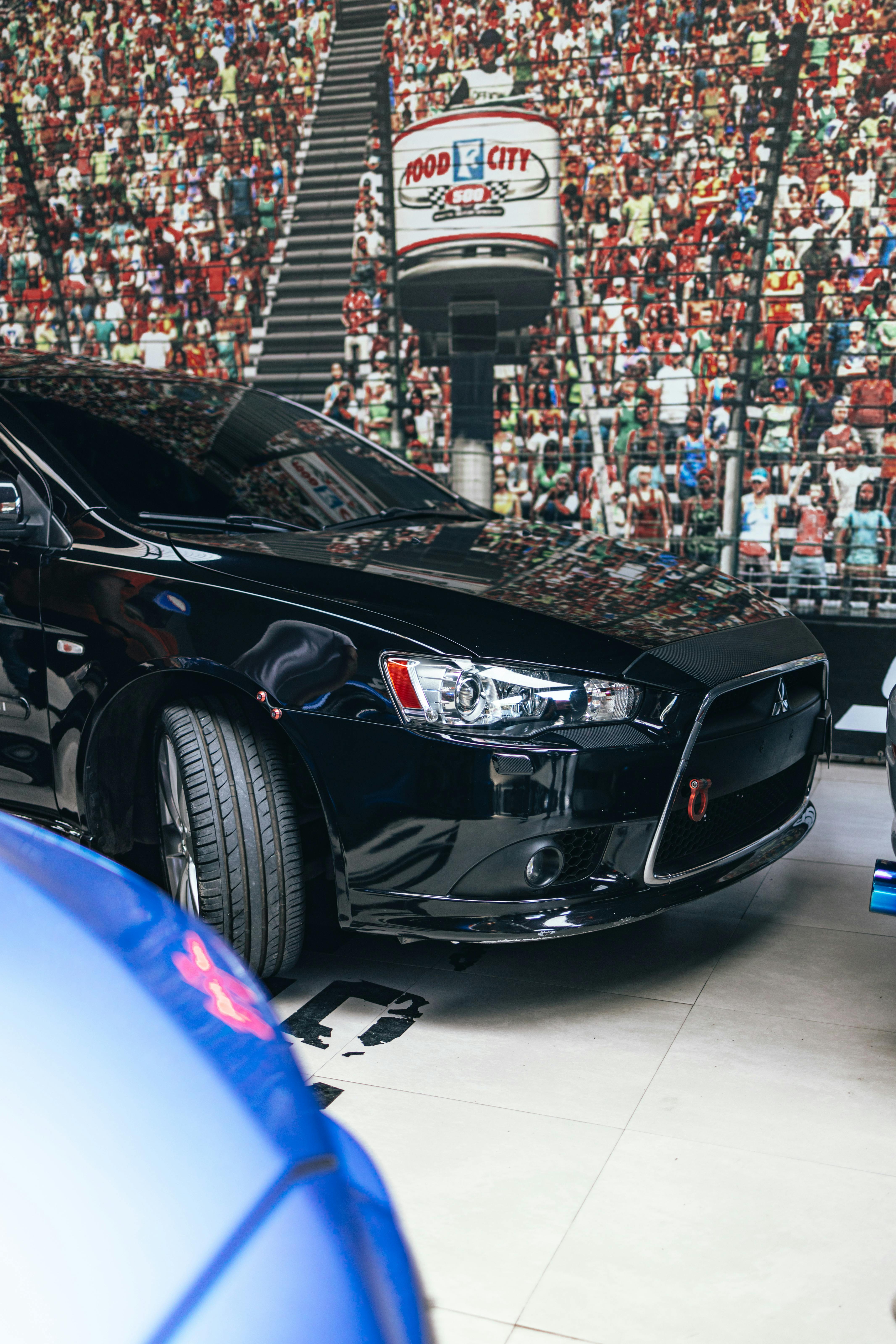Black Mitsubishi Lancer Evolution on a Public Show · Free Stock Photo