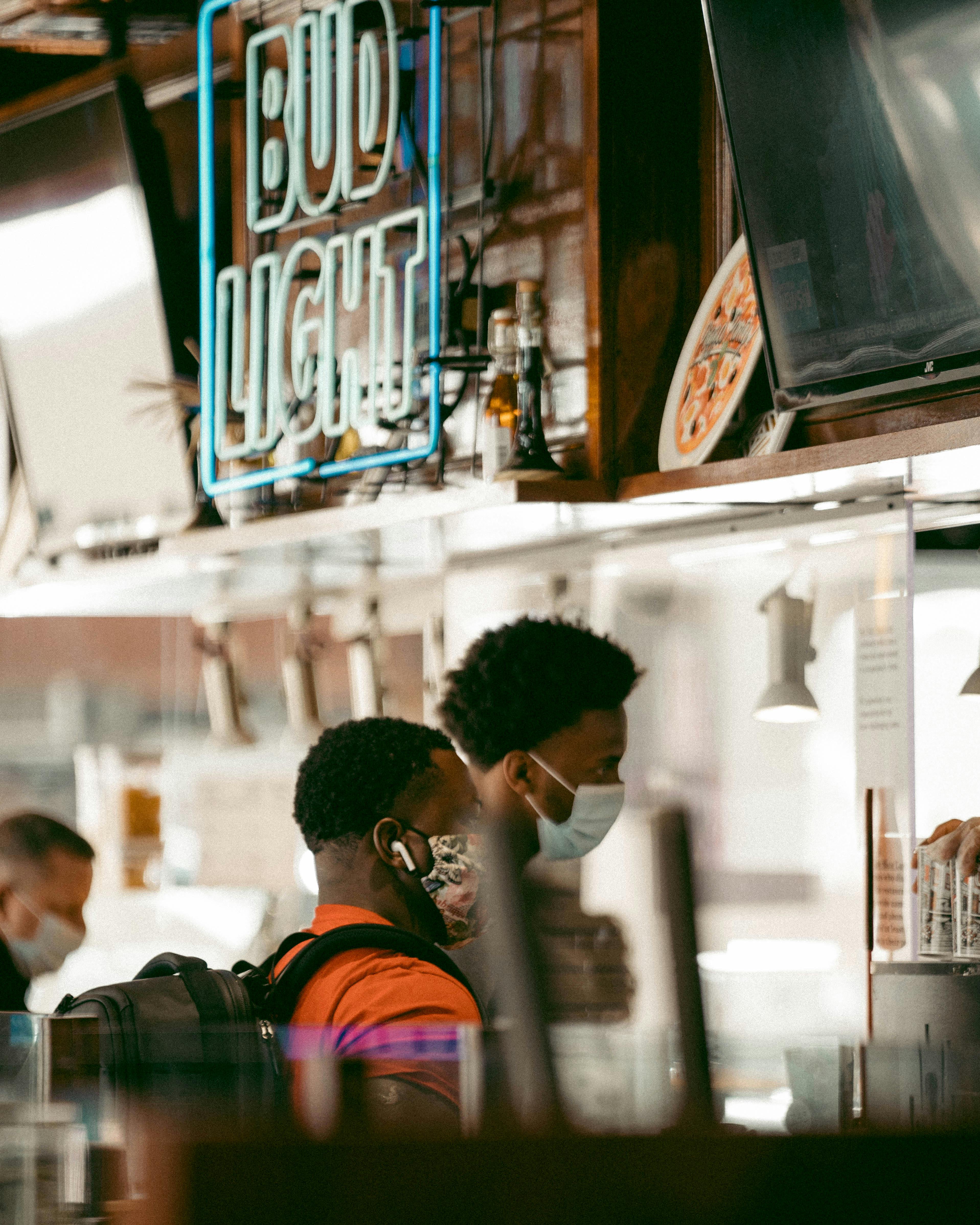 Men Wearing Face Masks in a Fast Food Restaurant · Free Stock Photo