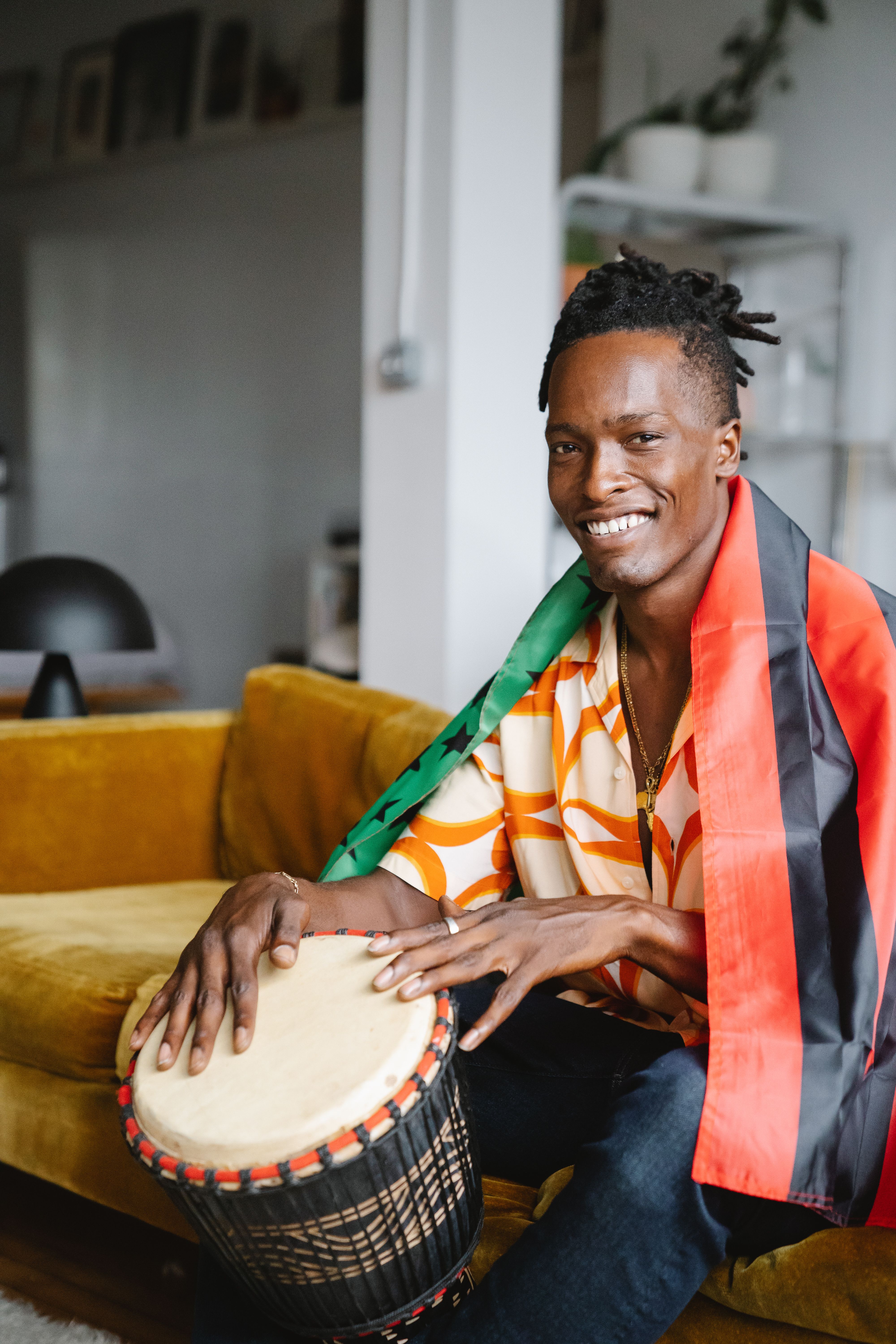 A Man Playing a Djembe · Free Stock Photo