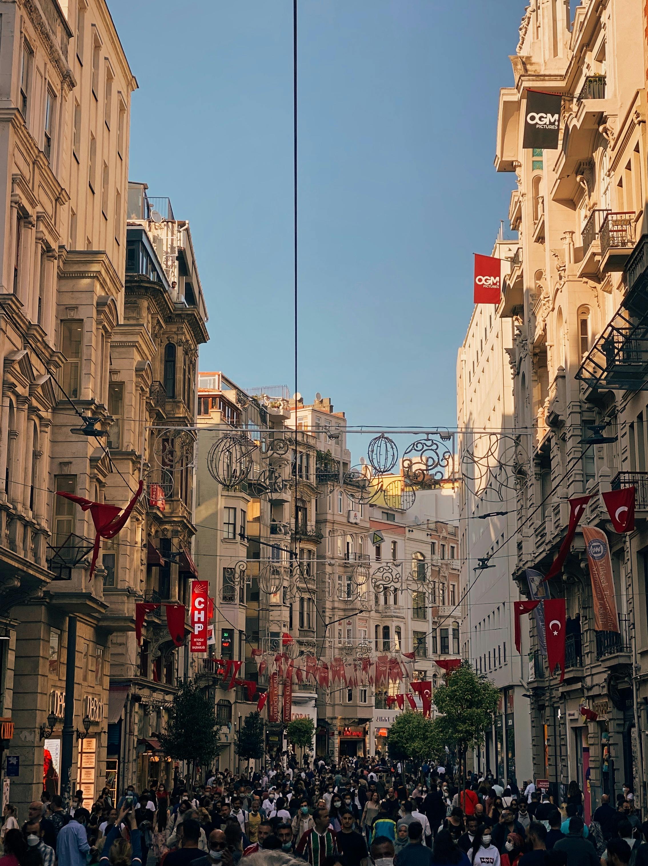 People Walking between Buildings · Free Stock Photo