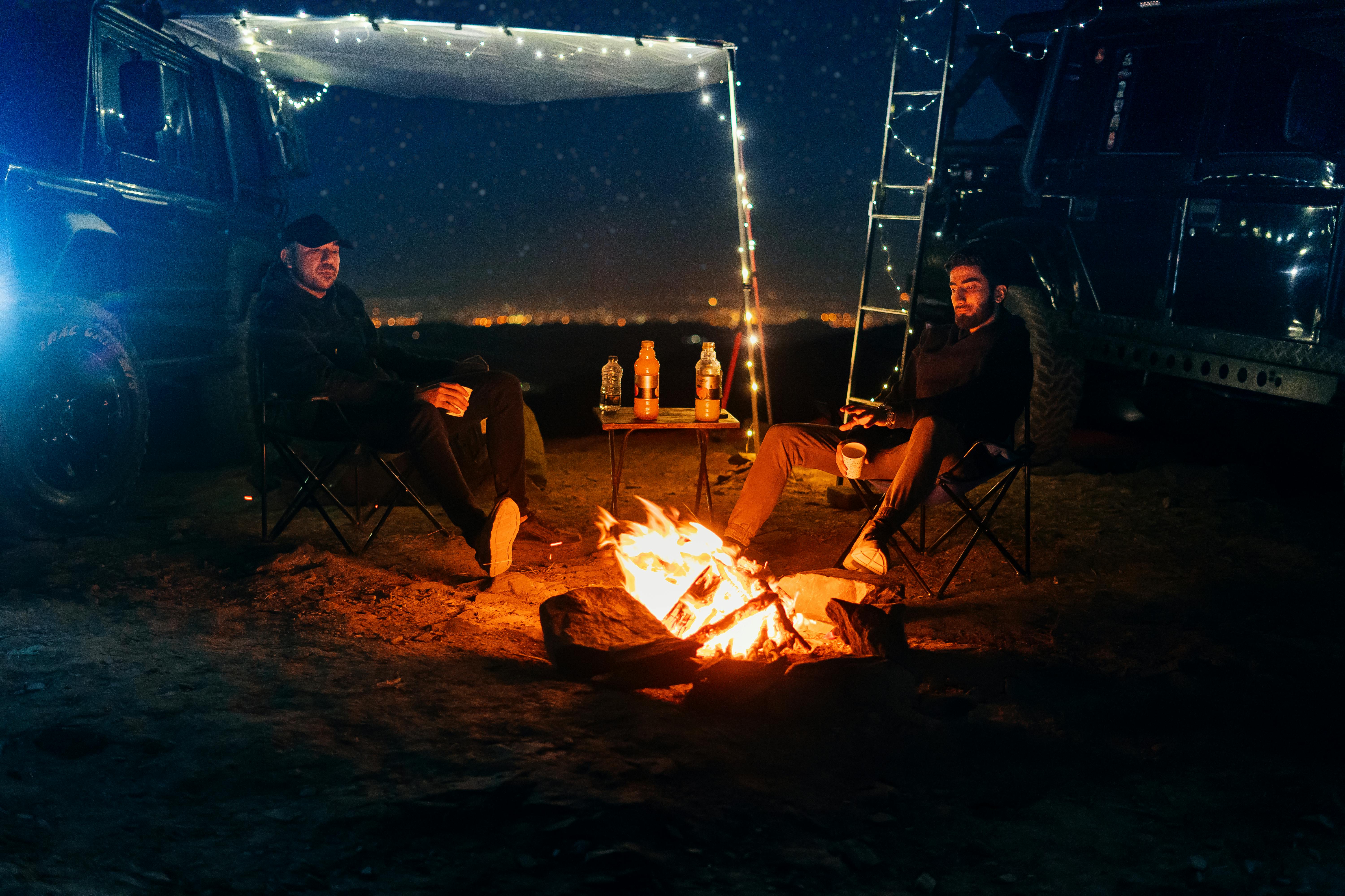 Men Sitting Near the Campfire · Free Stock Photo