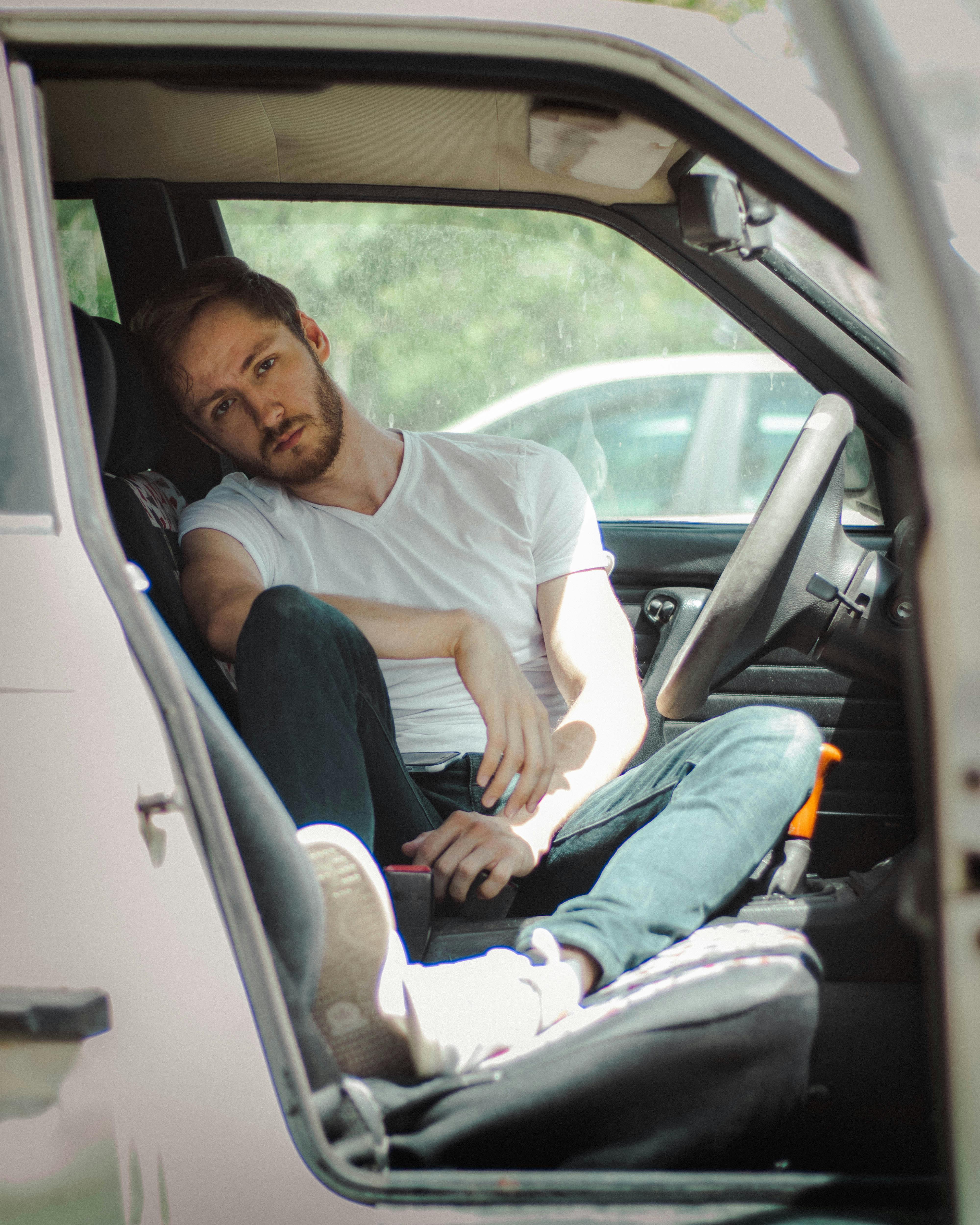 Man Sitting inside a Car · Free Stock Photo