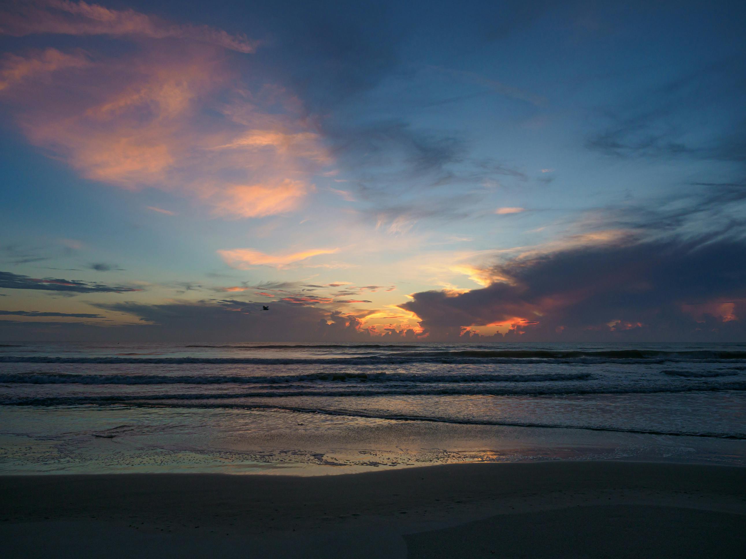 Scenic View of Sea Against Dramatic Sky · Free Stock Photo