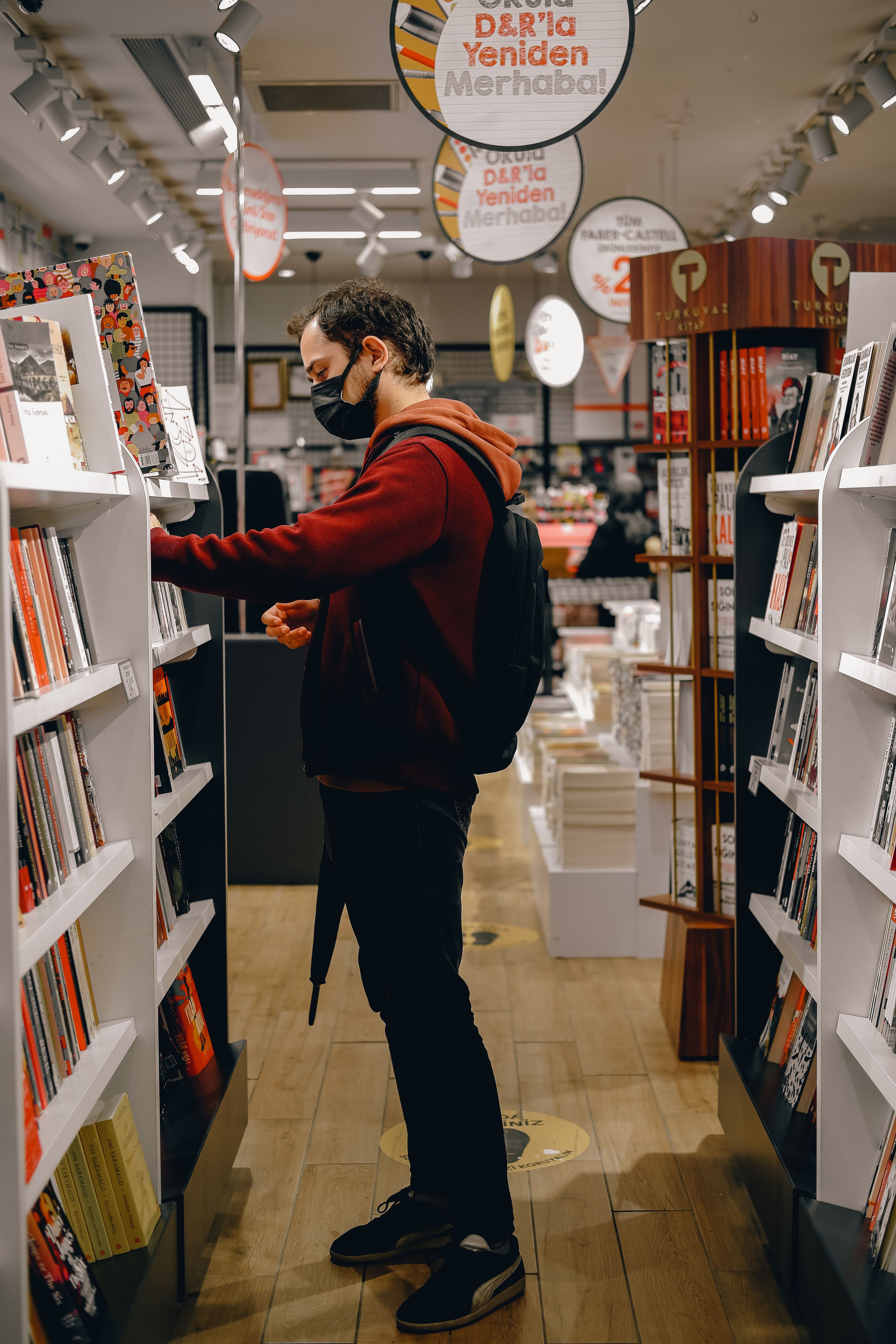 A Man Browsing at a Bookstore · Free Stock Photo