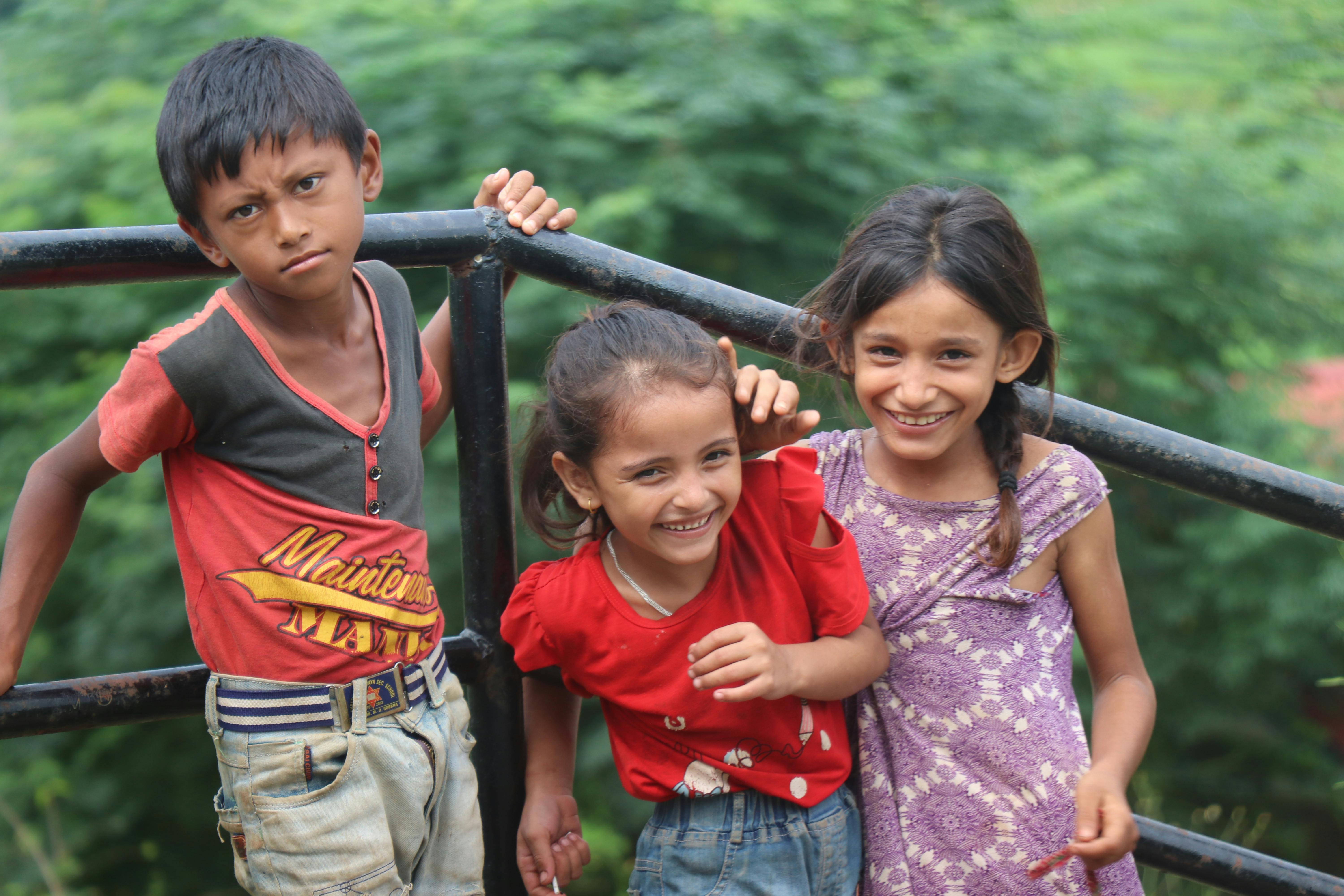 Kids Standing Near the Metal Railings · Free Stock Photo