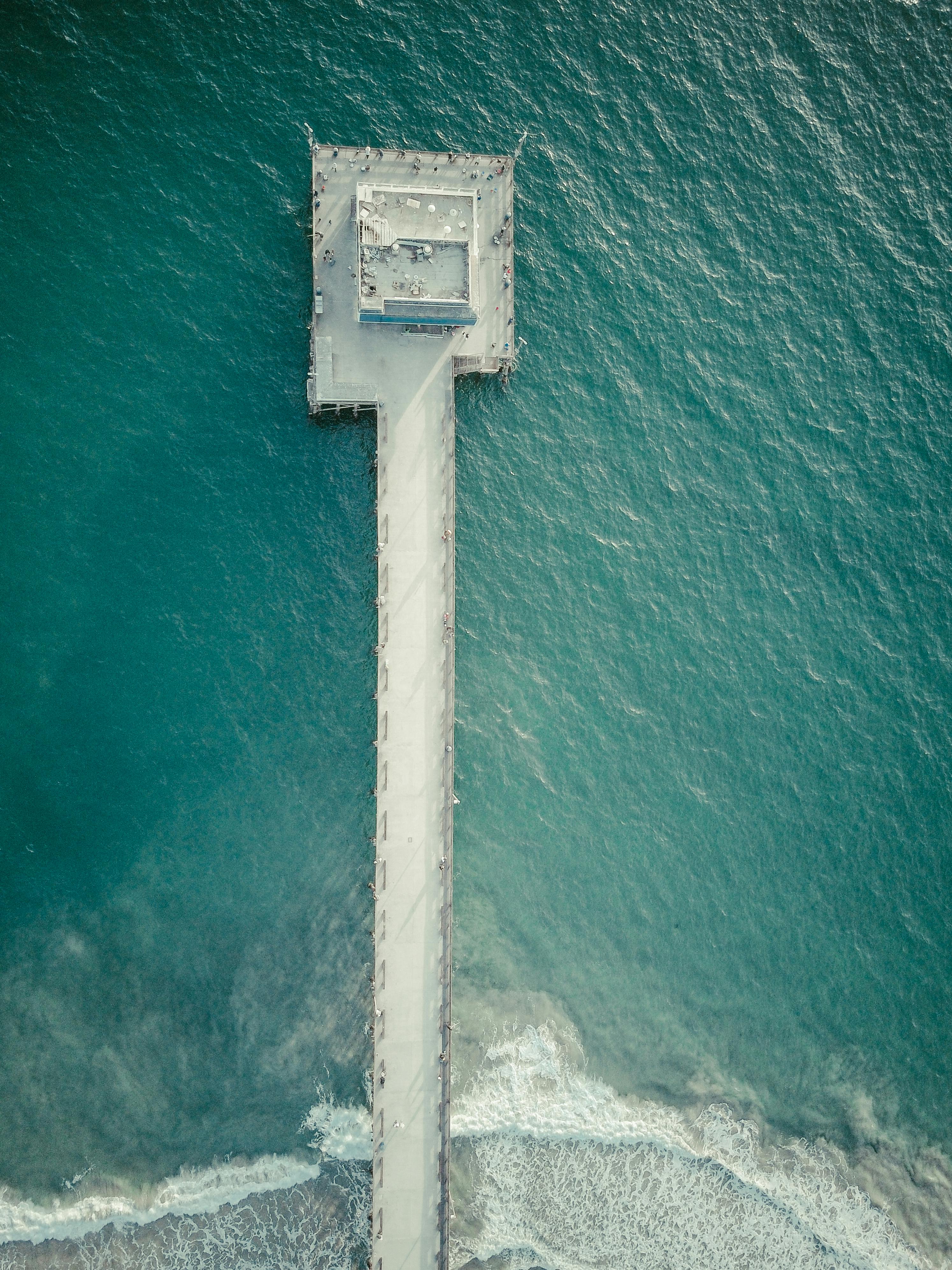 Aerial View of Concrete Jetty in Turquoise Water · Free Stock Photo