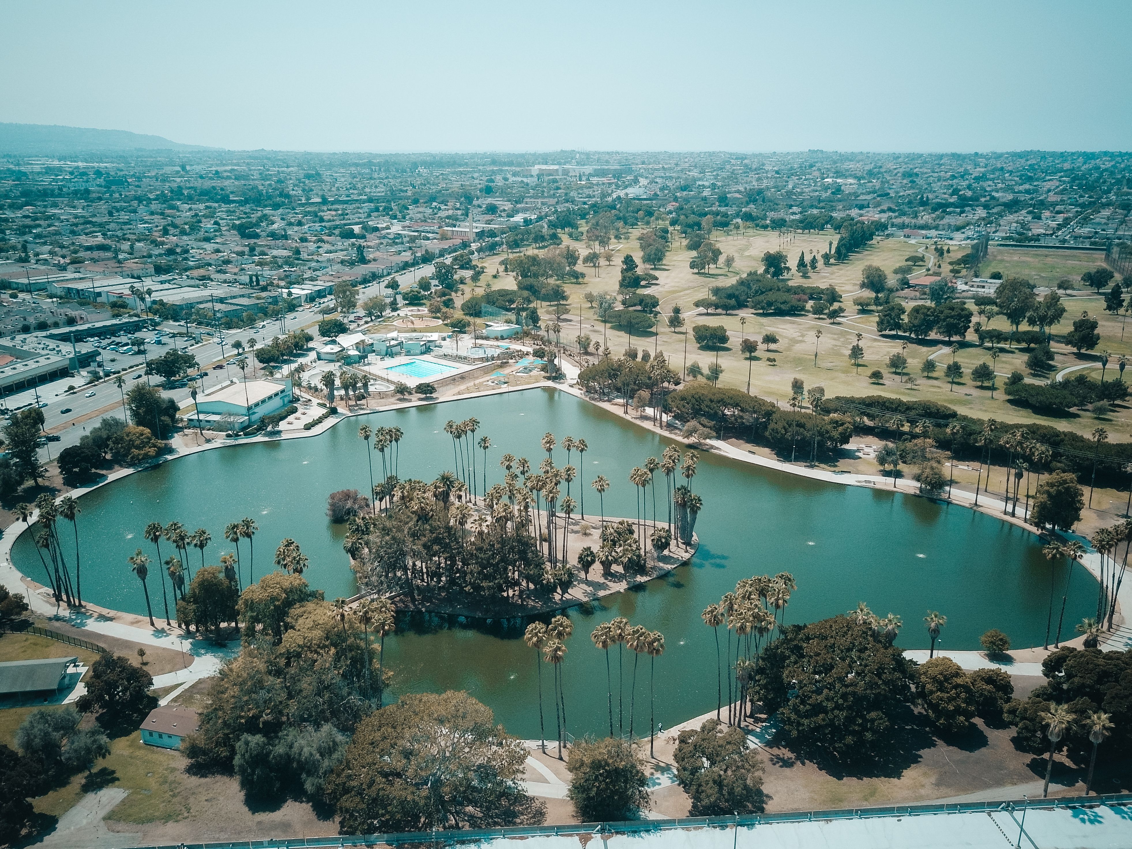 Aerial View of Island Lake Near City · Free Stock Photo