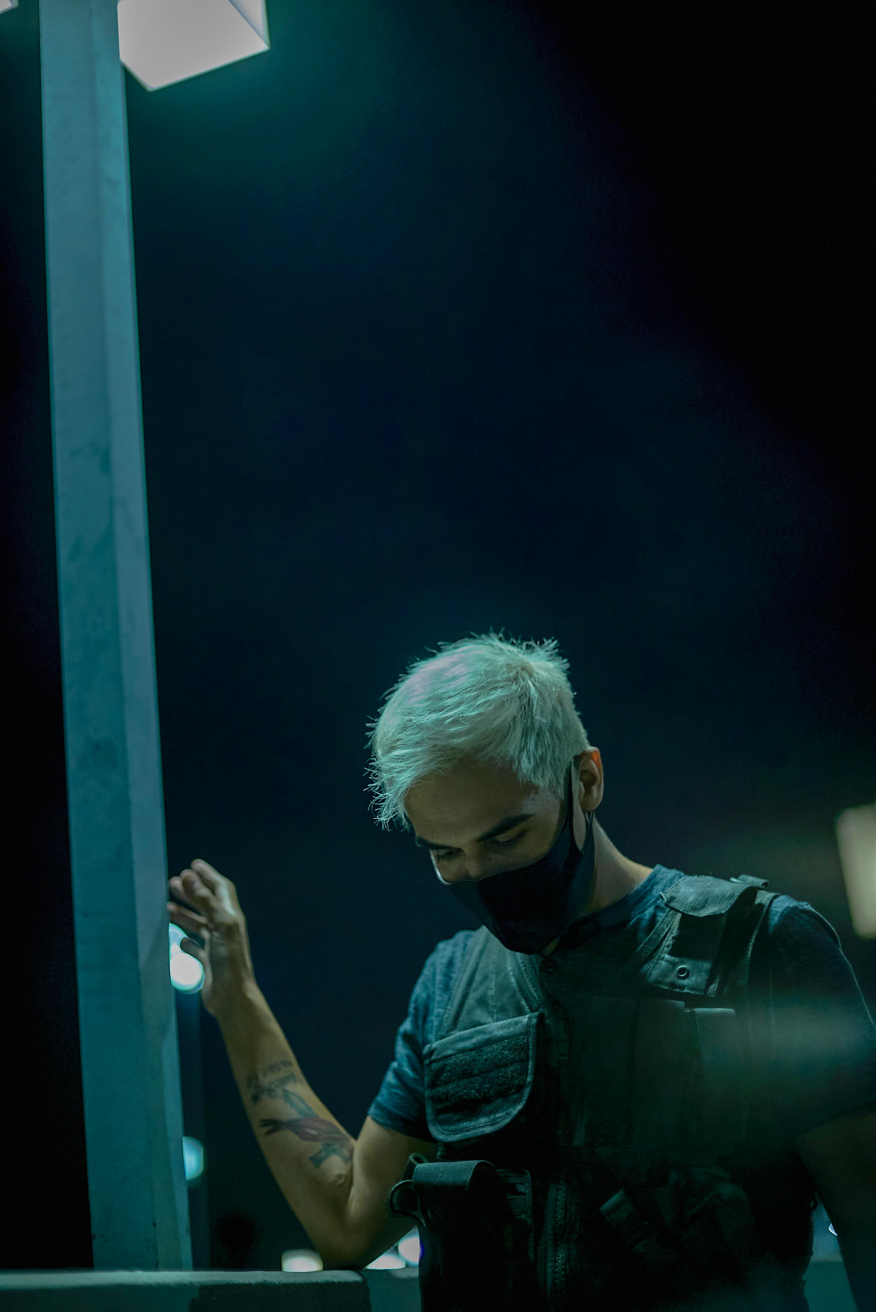 Man Sticking Poster on Glass Door · Free Stock Photo