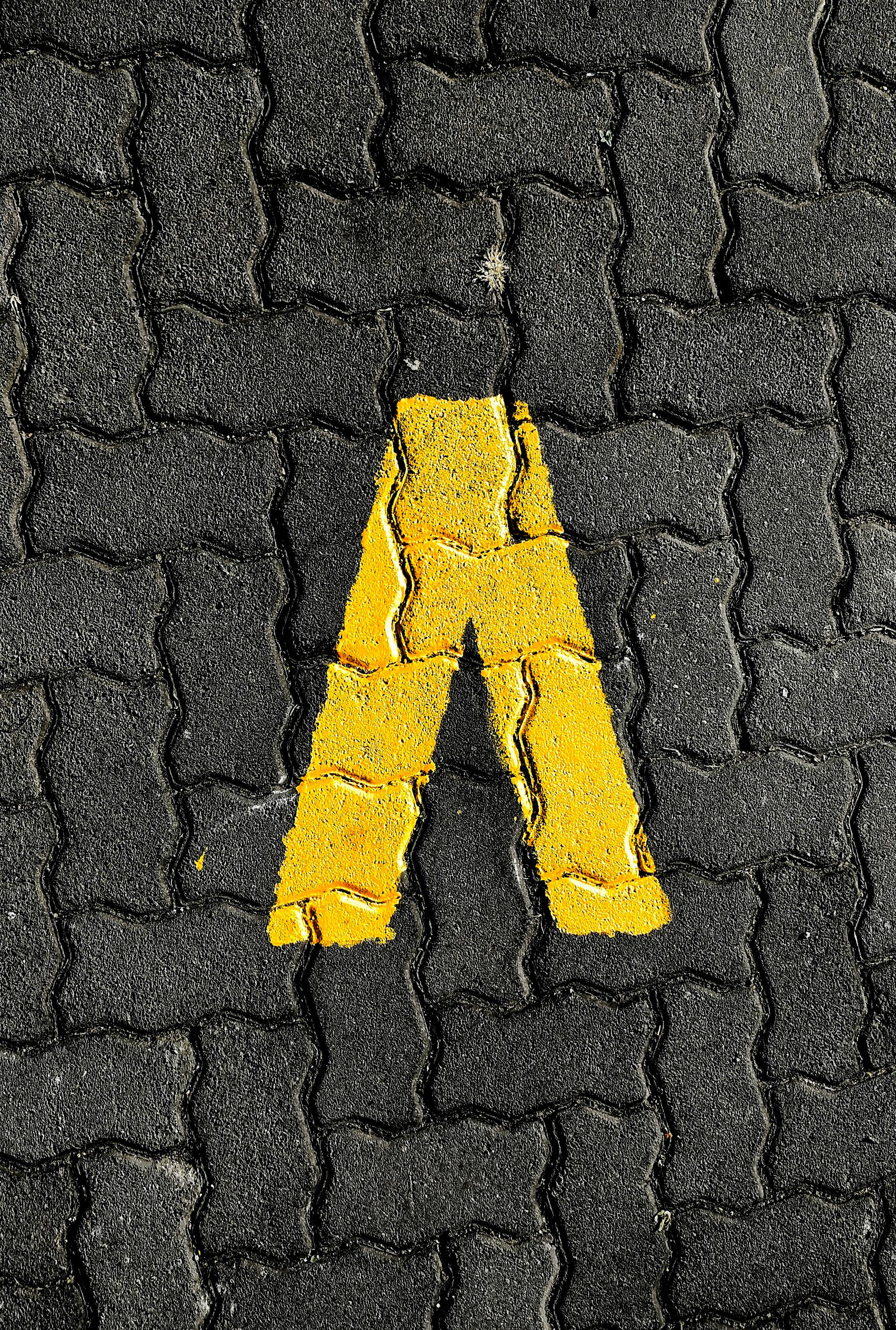 Yellow Sign On A Clay Pavers · Free Stock Photo