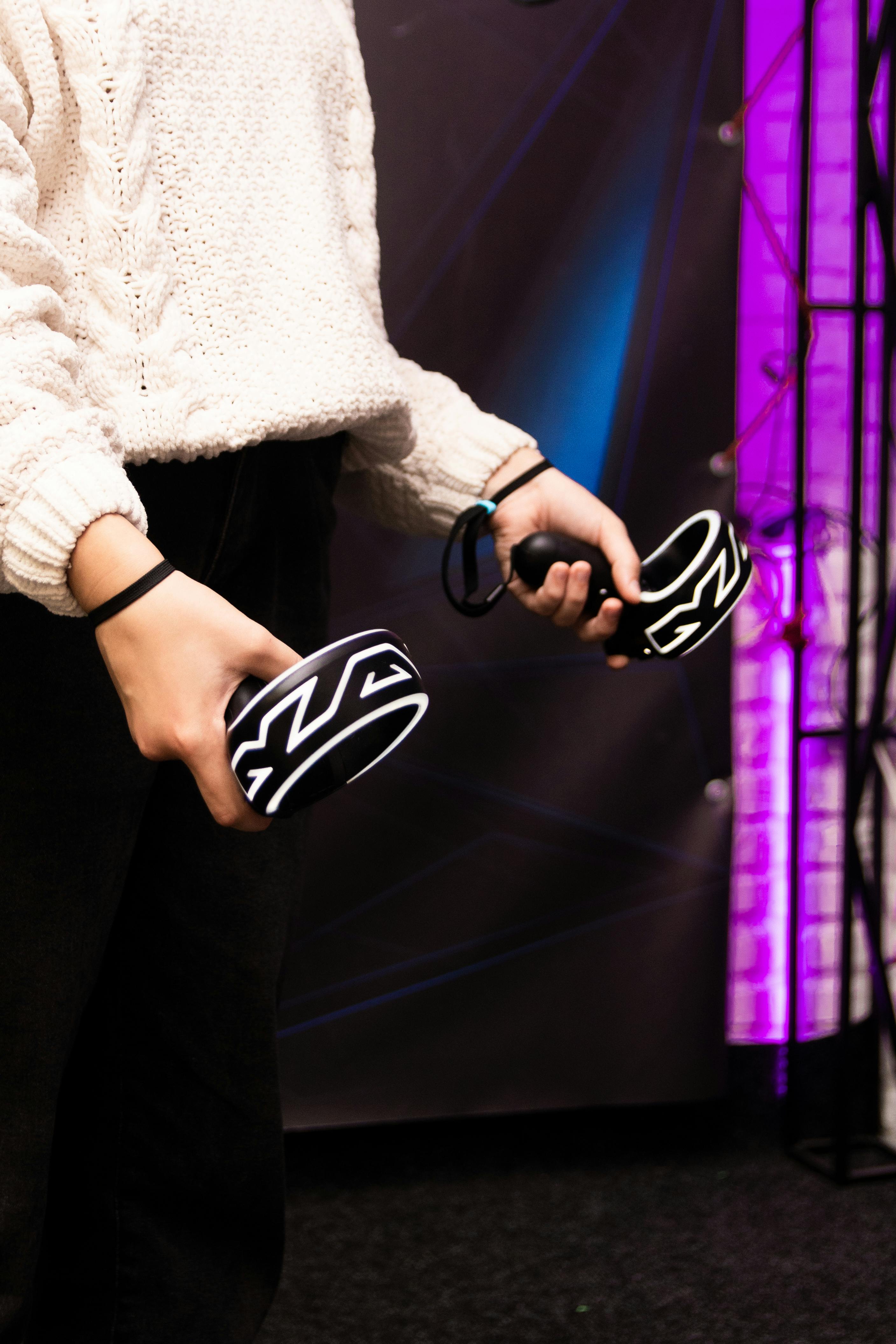 A Person Holding a VR Game Controller · Free Stock Photo