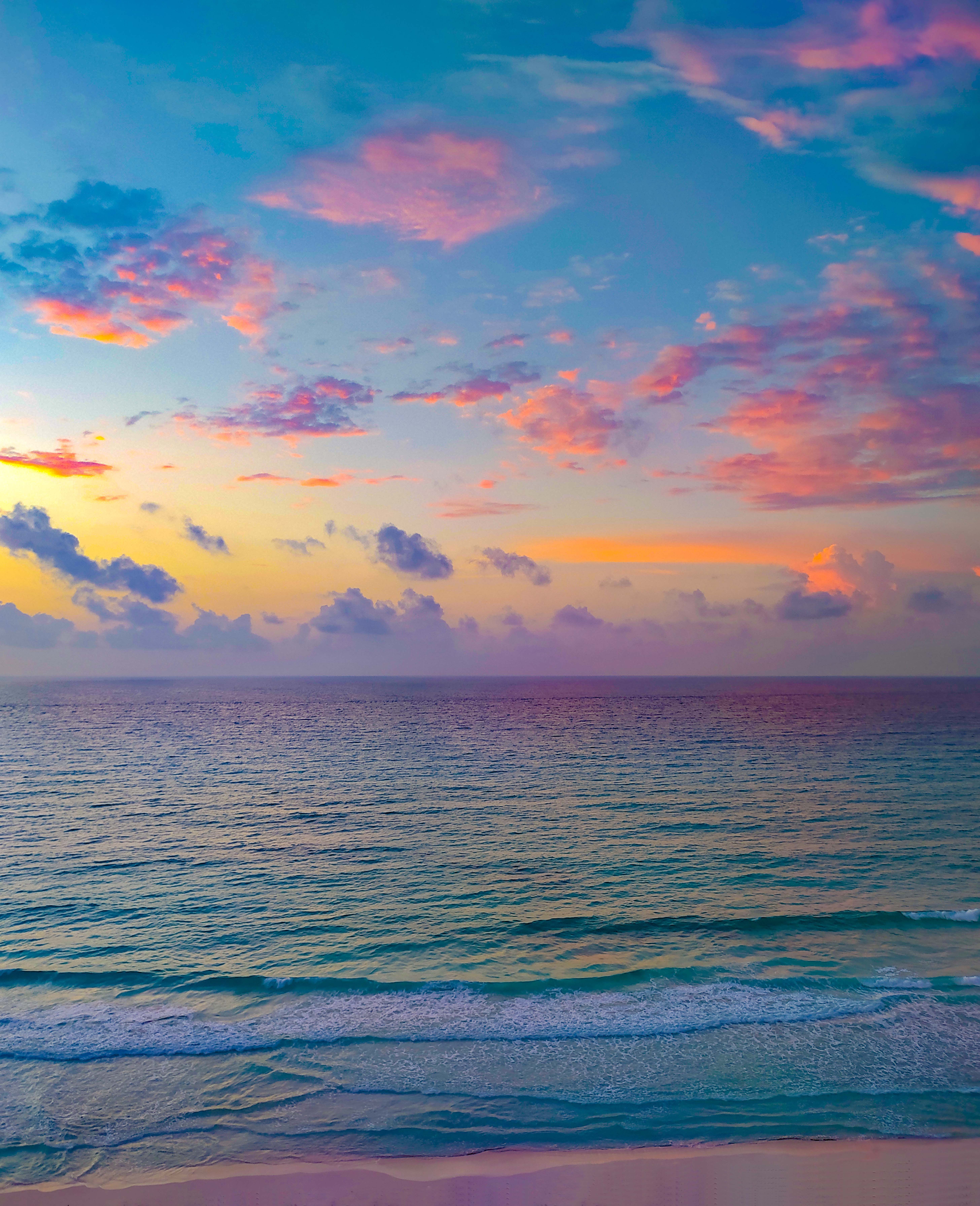 Multi Colored Clouds Drifting over Ocean · Free Stock Photo