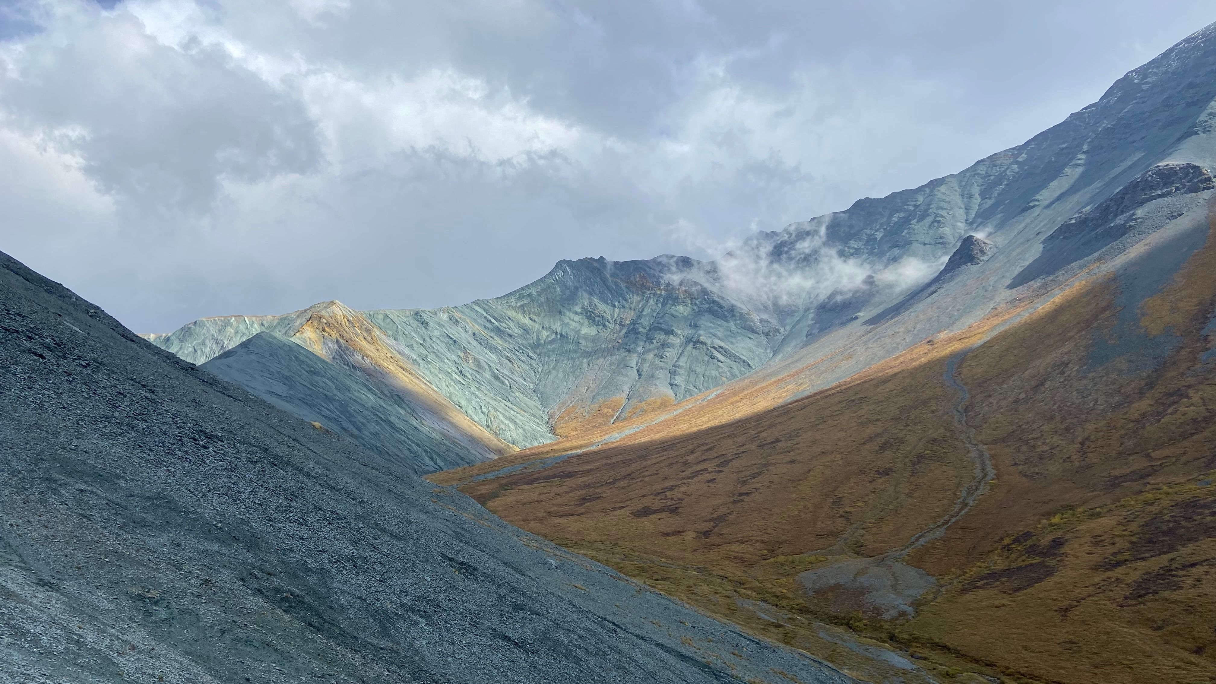 Gray Rocky Mountains Under the White Clouds · Free Stock Photo