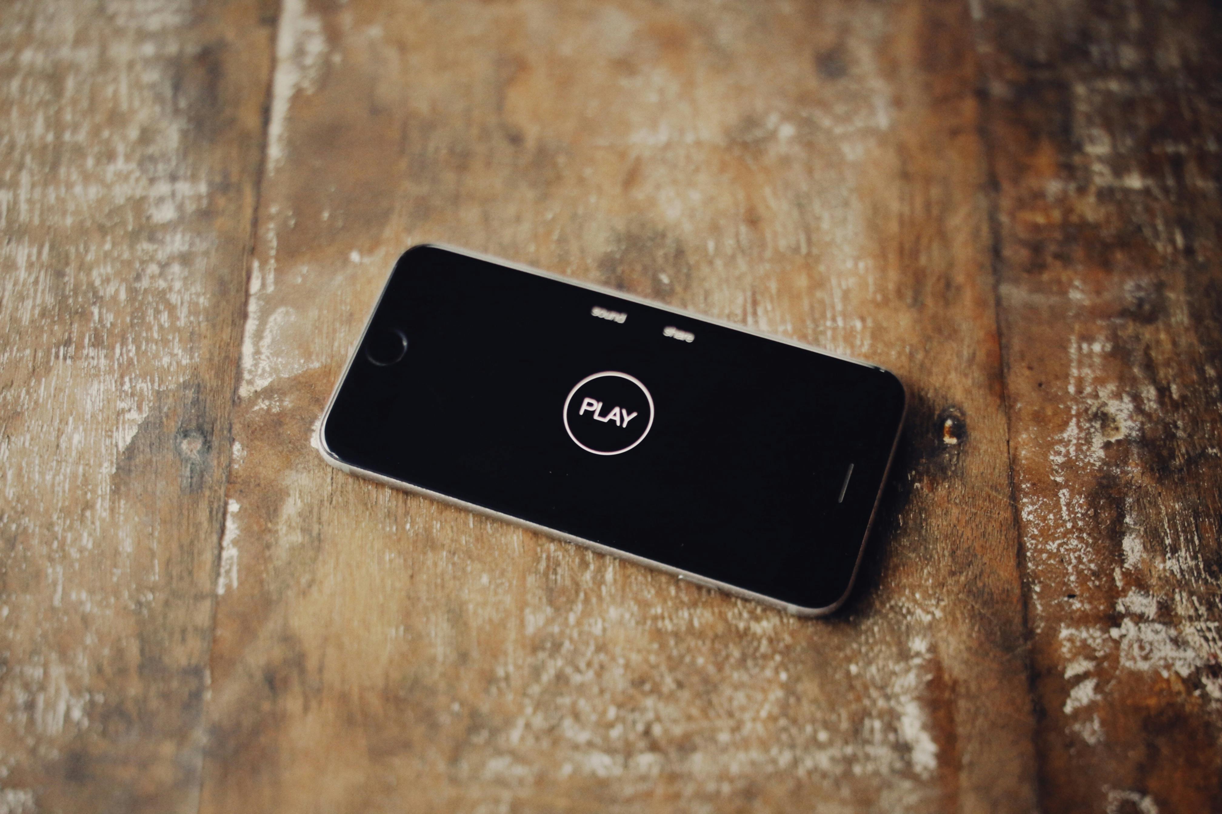 Black Iphone On Wooden Table · Free Stock Photo
