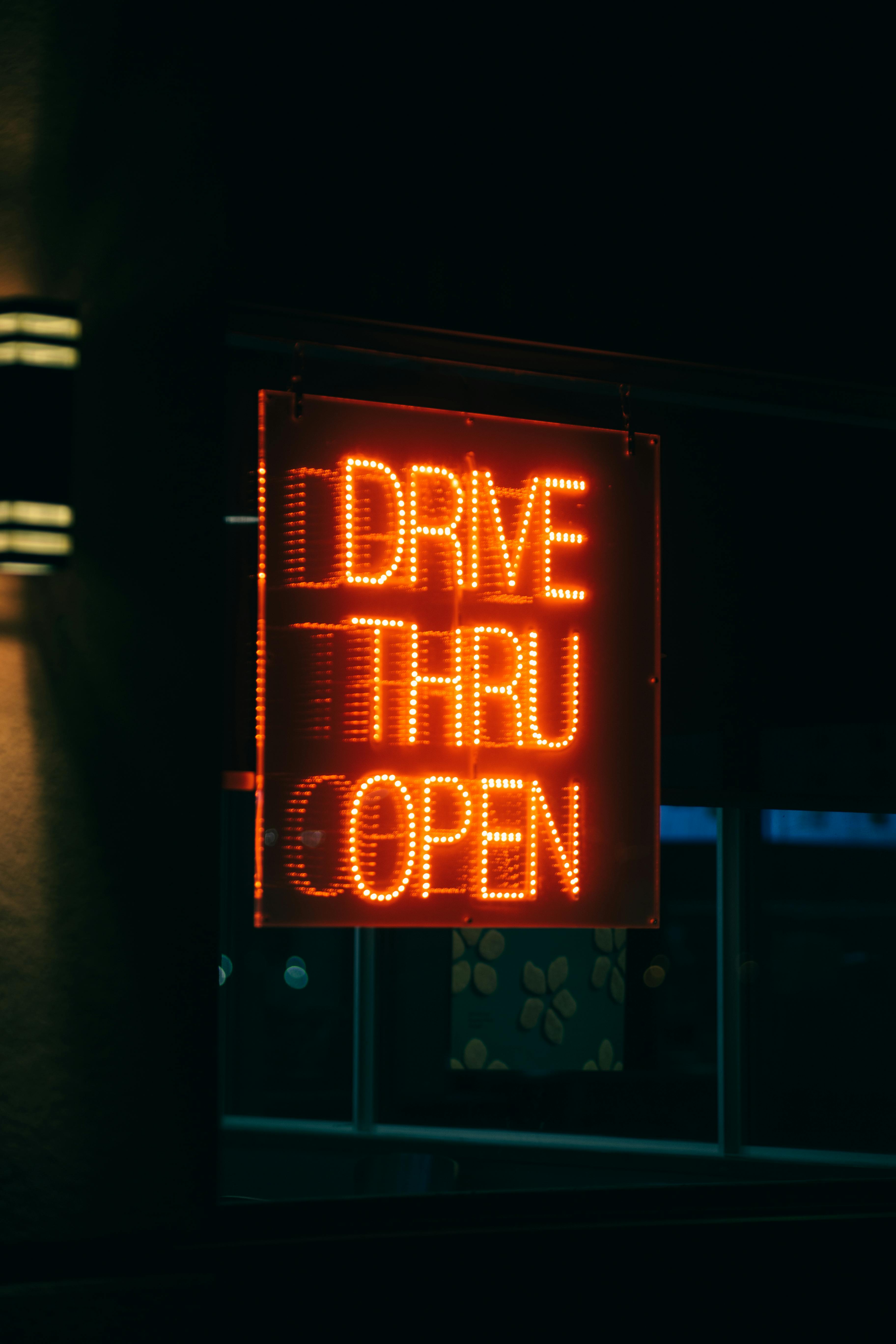 Close up view of neon drivethru sign · Free Stock Photo