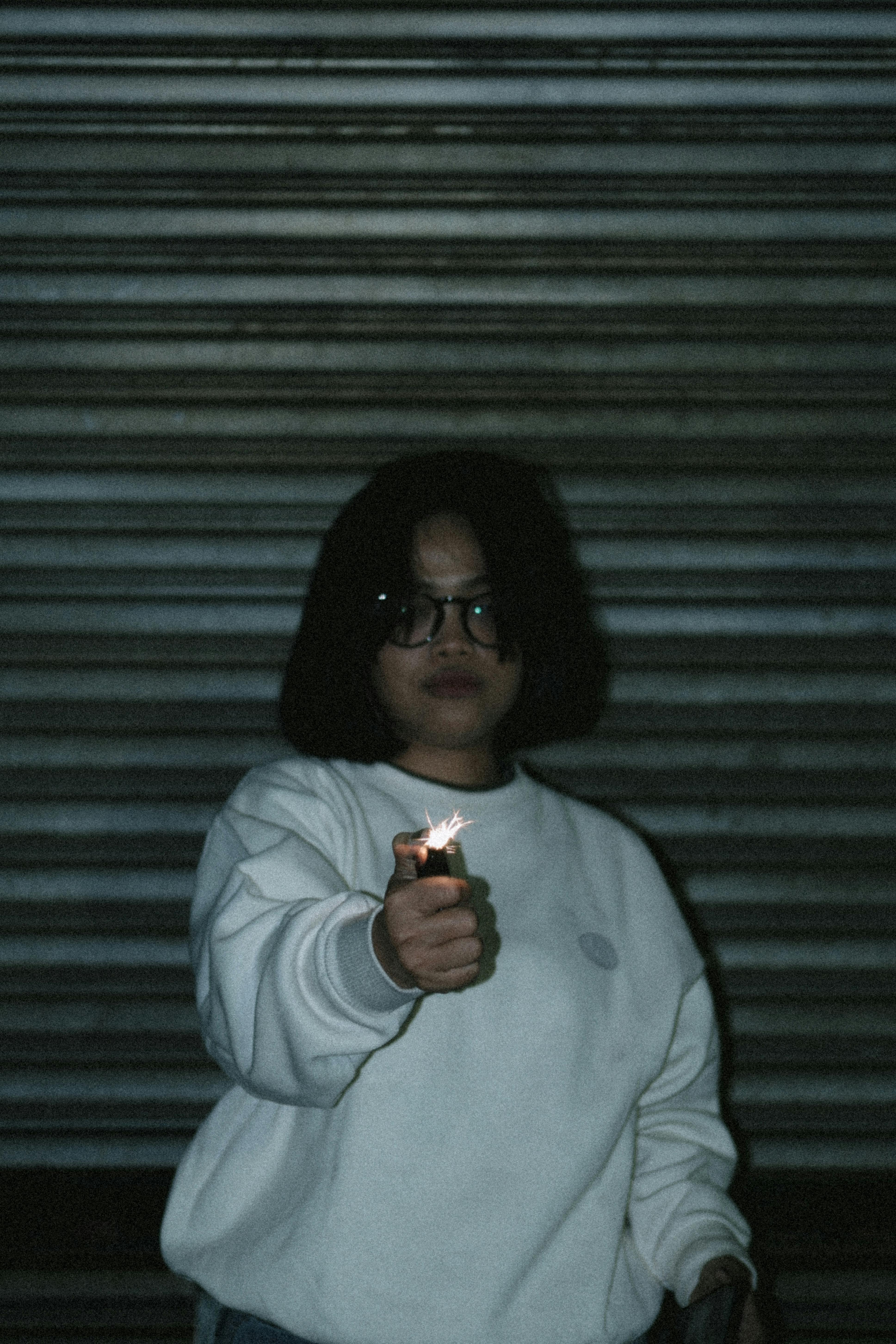 A Woman using a Lighter · Free Stock Photo