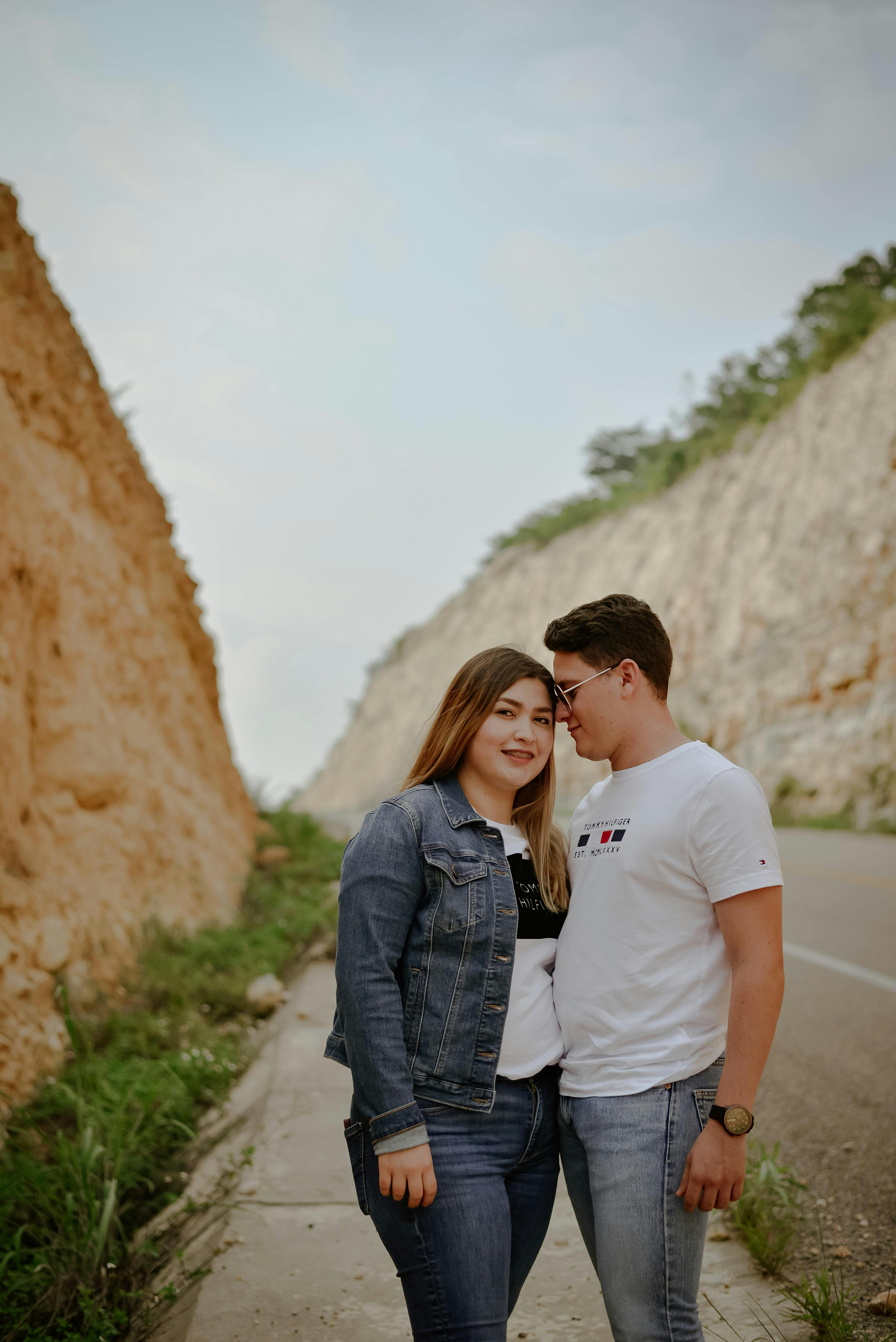 Woman and Man Cuddle on Field · Free Stock Photo