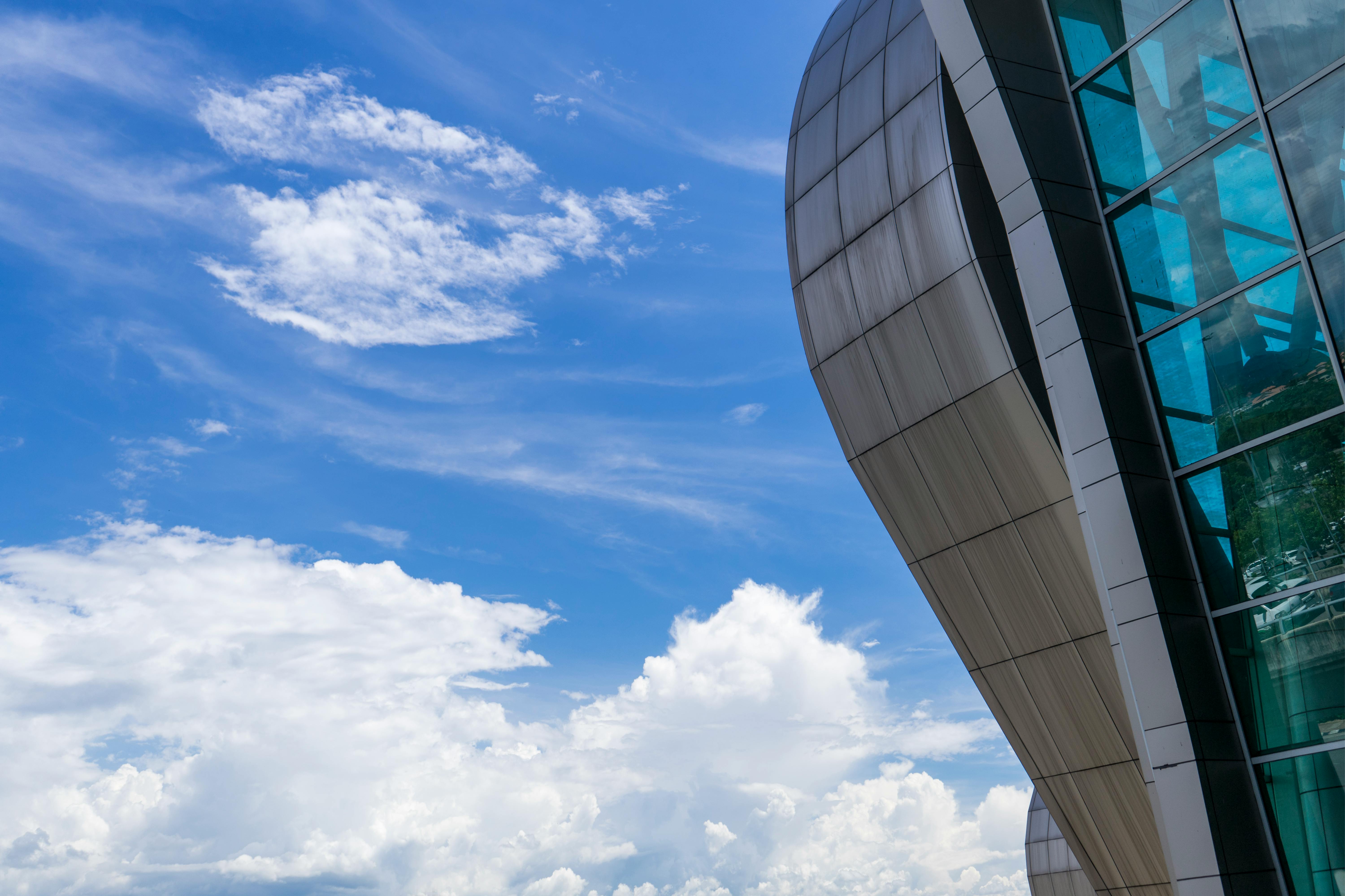 High-rise Building Under Blue Sky and White Clouds · Free Stock Photo
