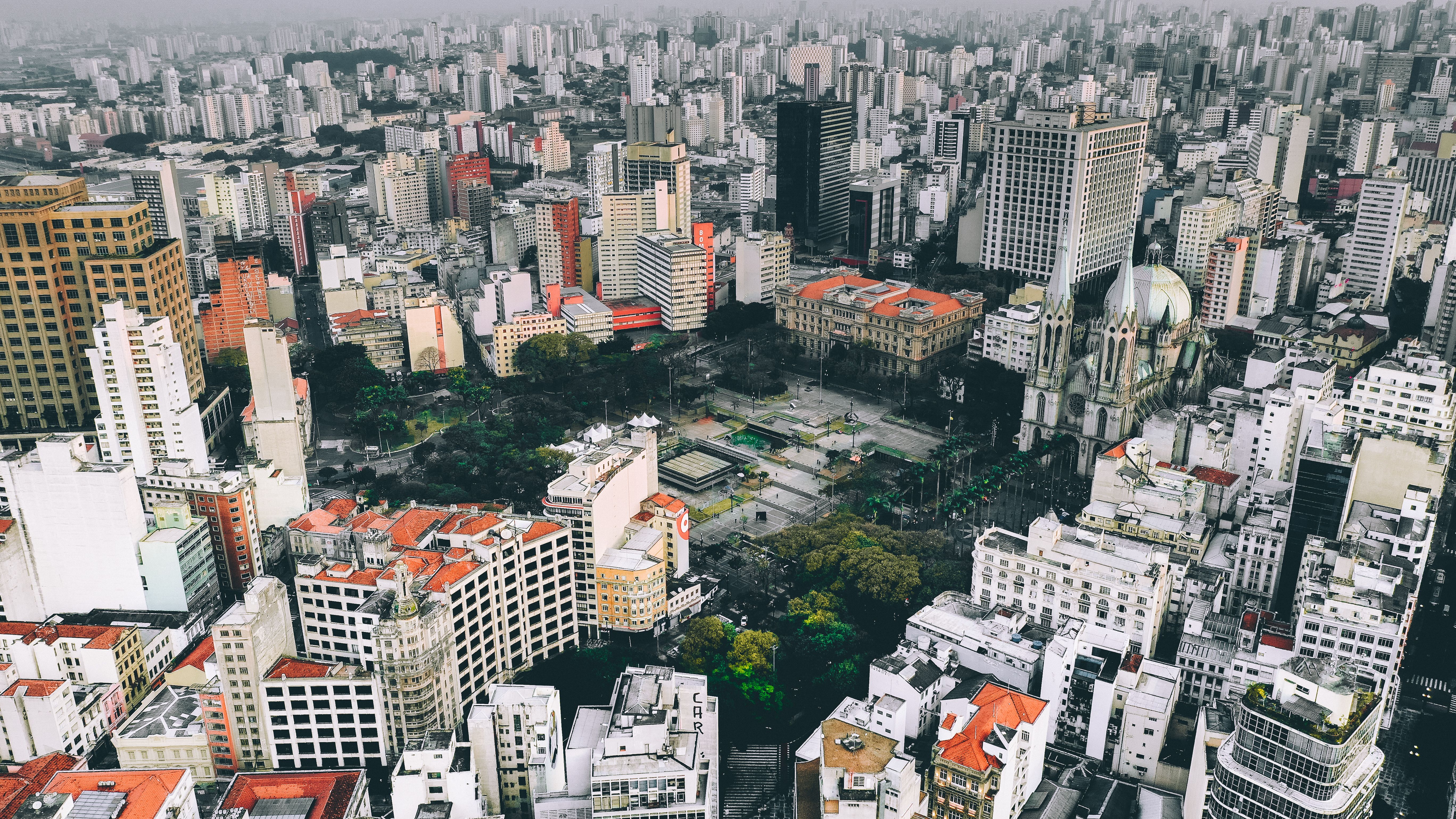 Aerial Shot of a River Between Buildings · Free Stock Photo