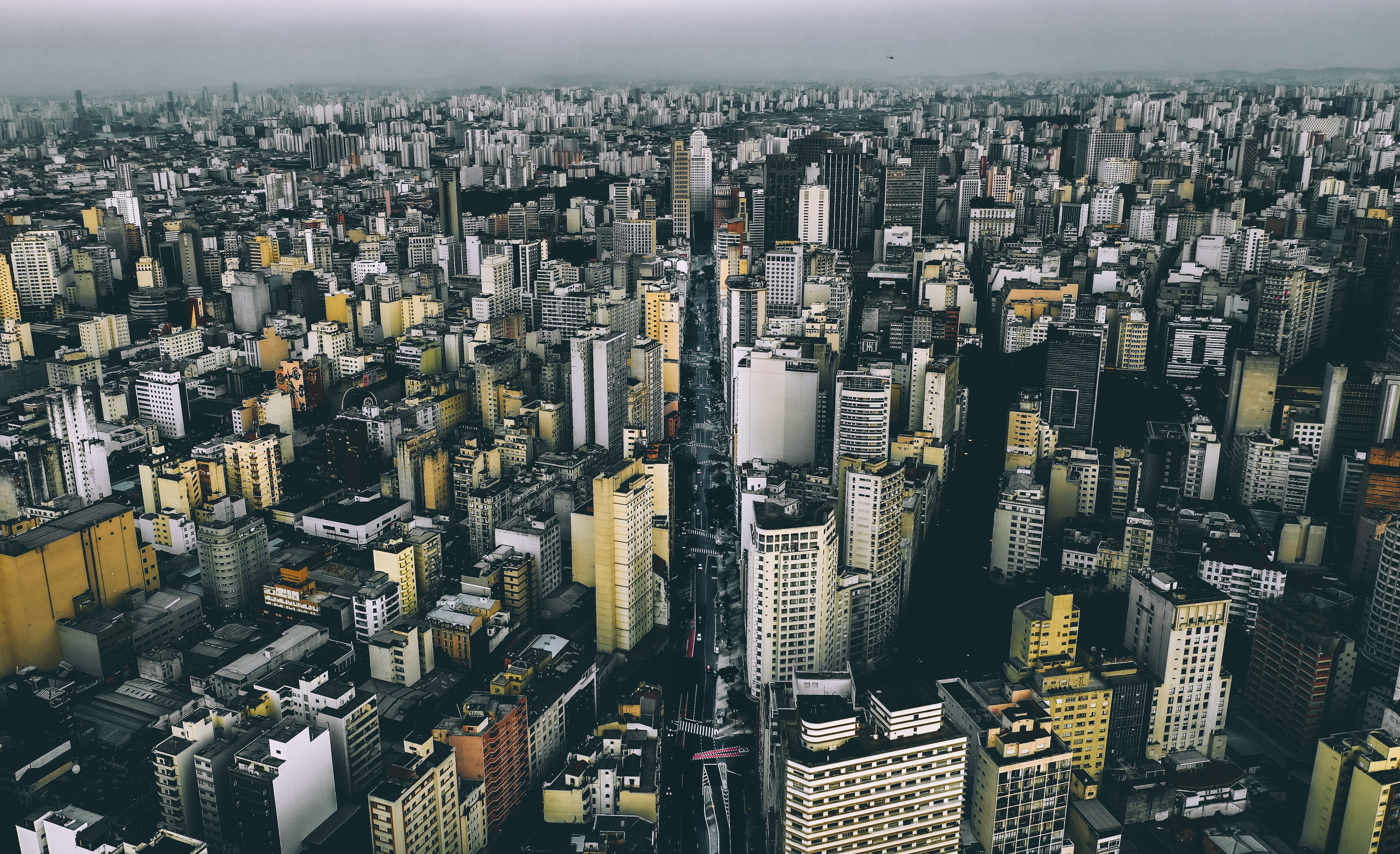 Aerial Shot of a River Between Buildings · Free Stock Photo