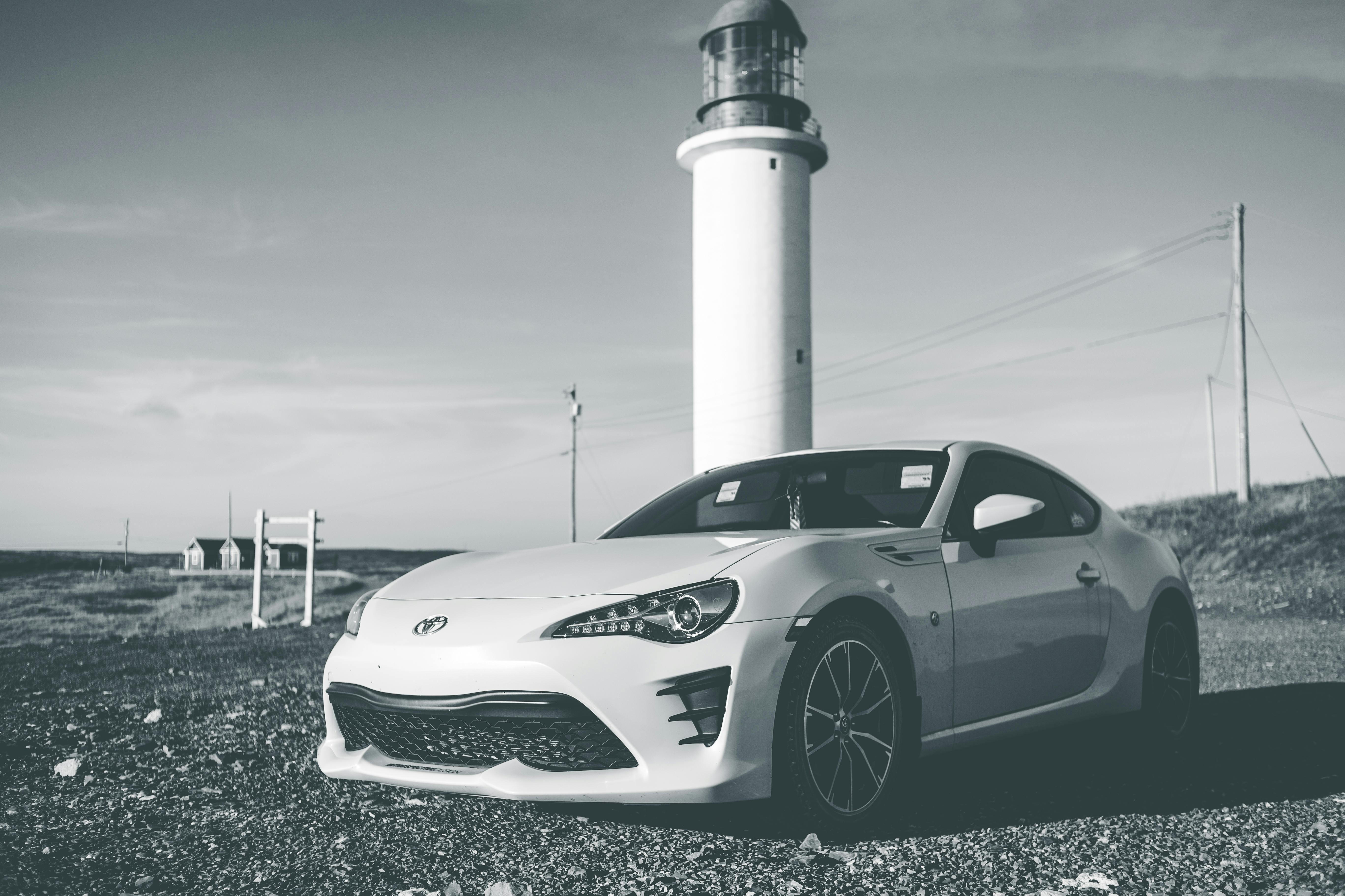 Grayscale Photo of a Coupe Car · Free Stock Photo
