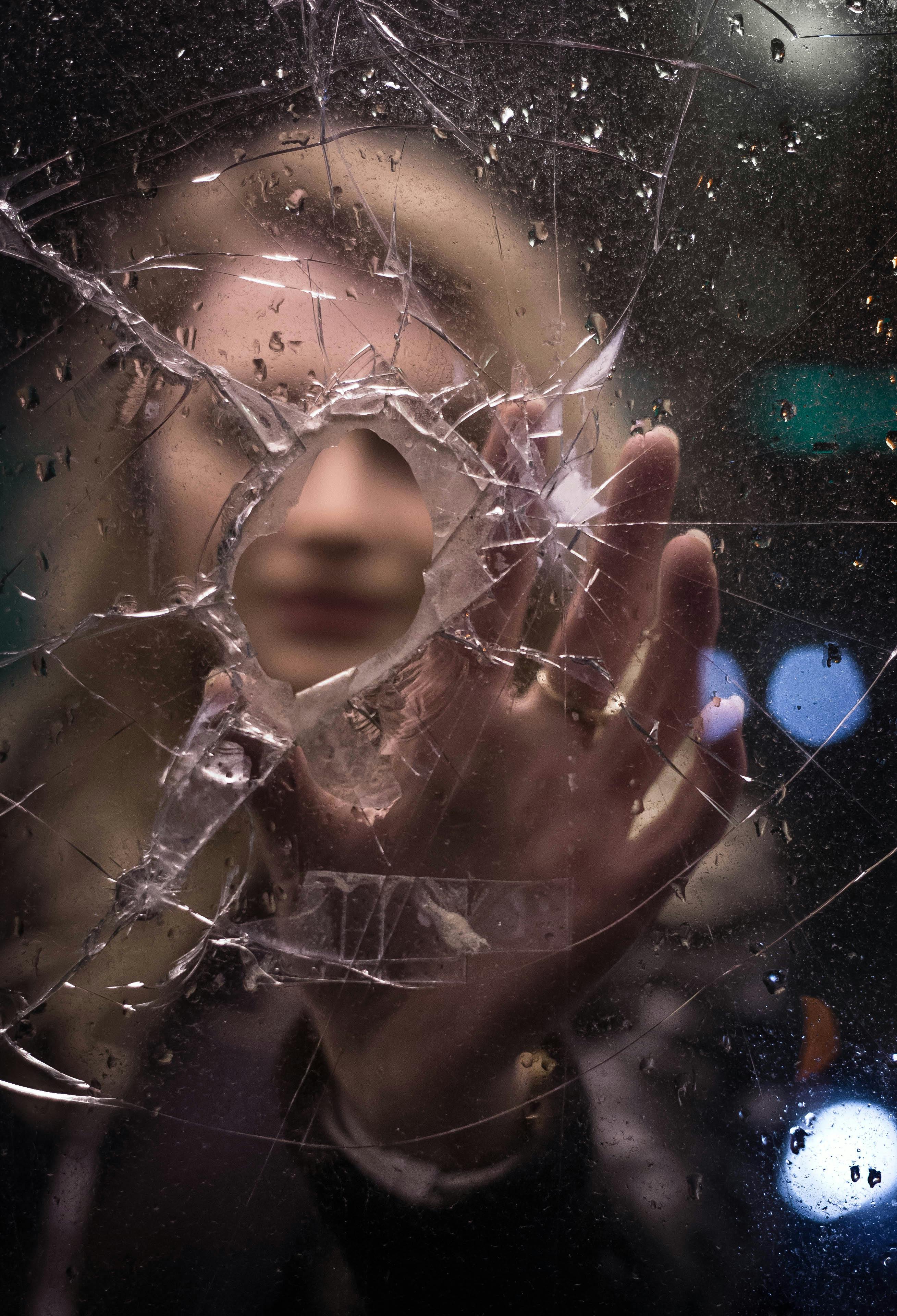 Reflection of Woman's Eye on Broken Mirror · Free Stock Photo