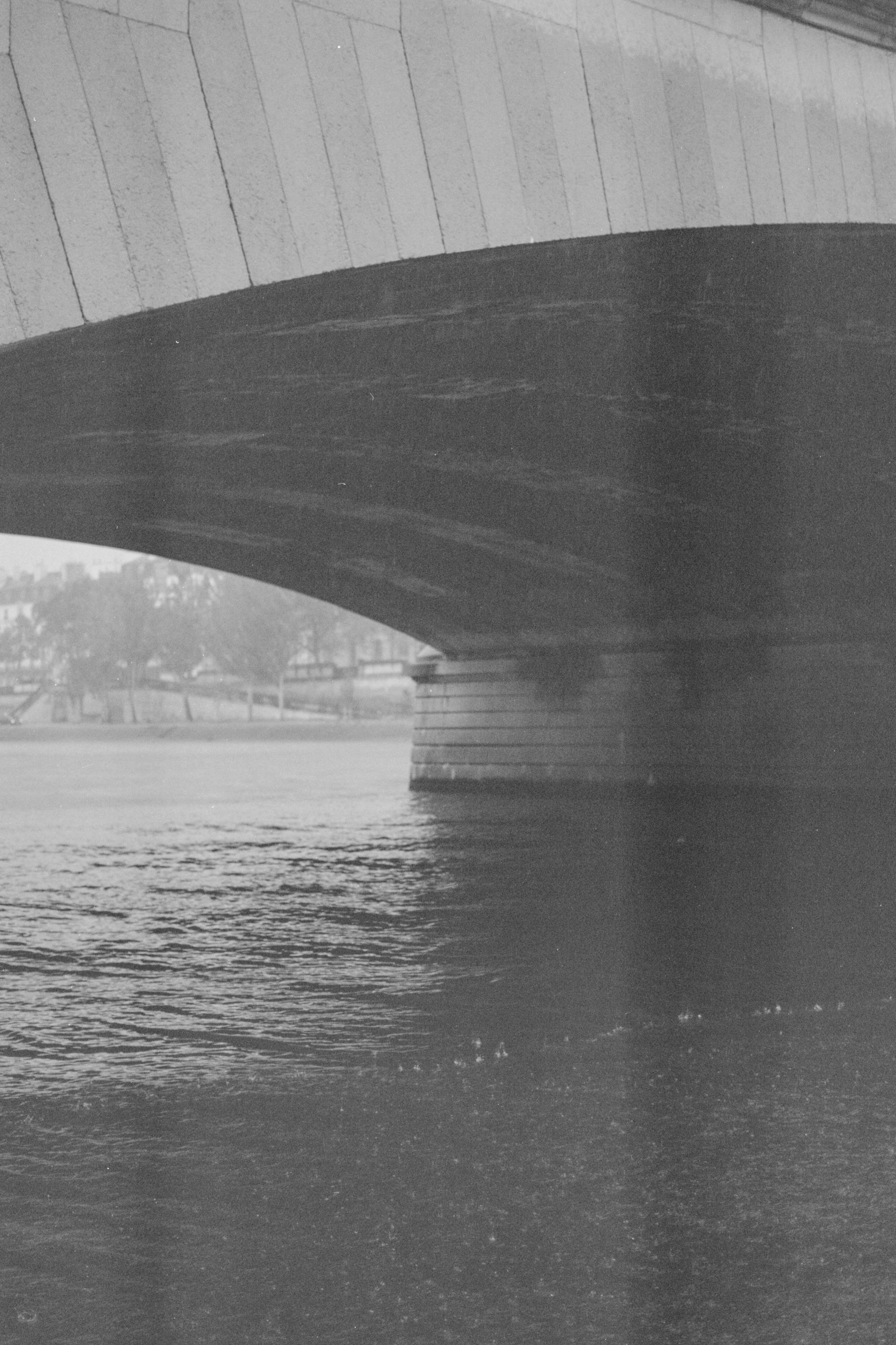 Grayscale Photo of Concrete Bridge Over River · Free Stock Photo