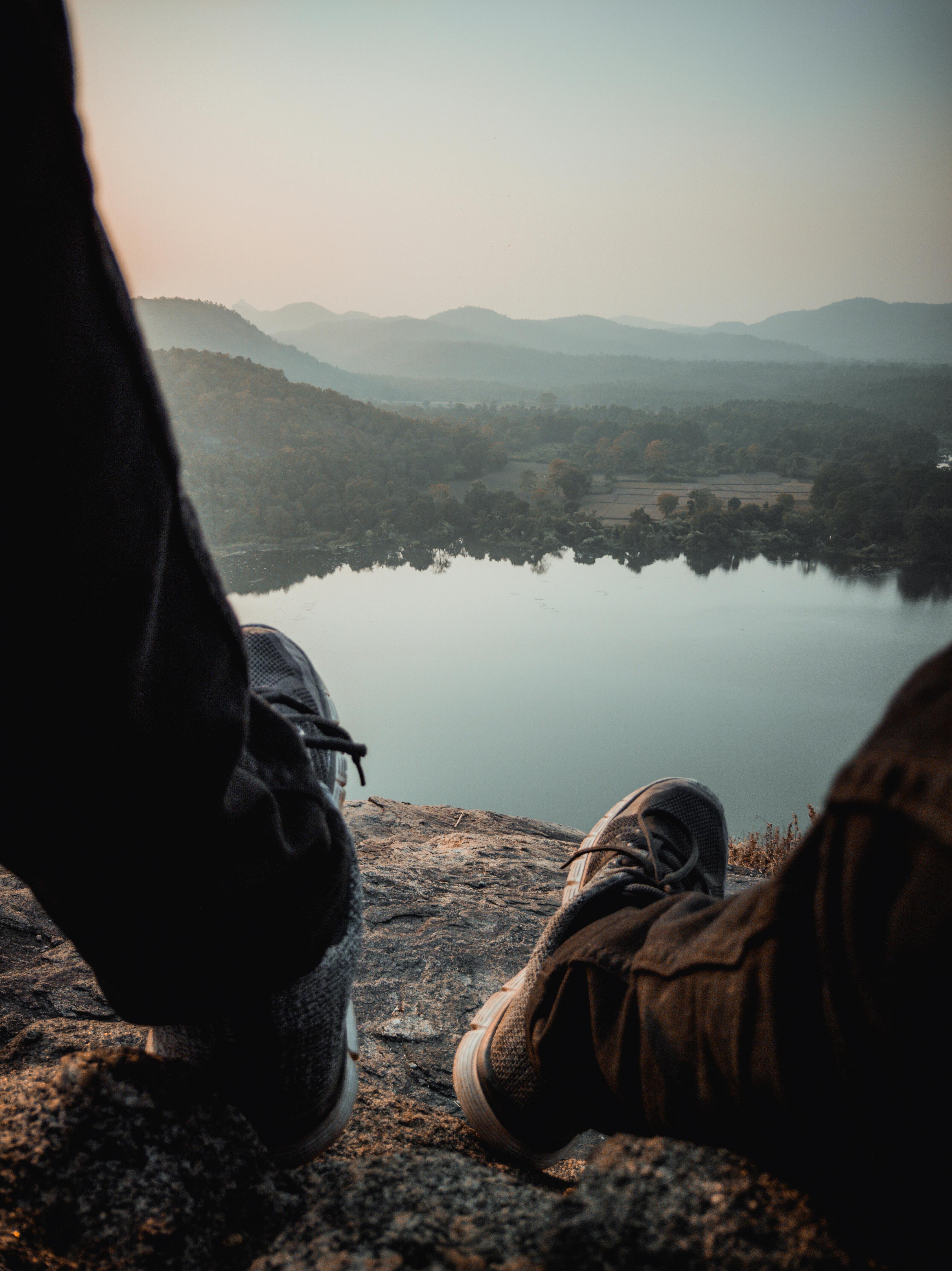 View of a Person on a Hill Looking at the Lake · Free Stock Photo