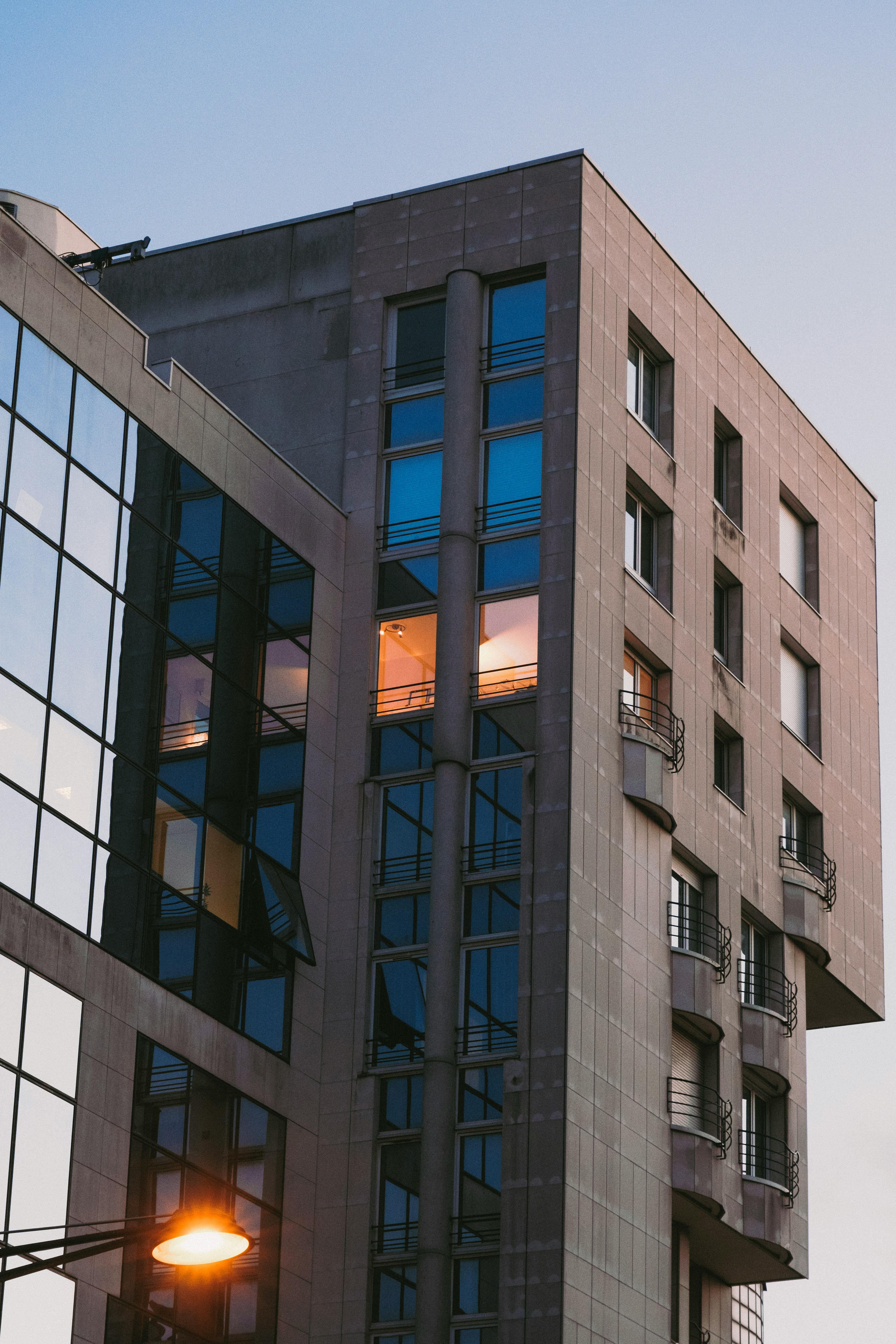 Modern Building Full of Glass Windows · Free Stock Photo