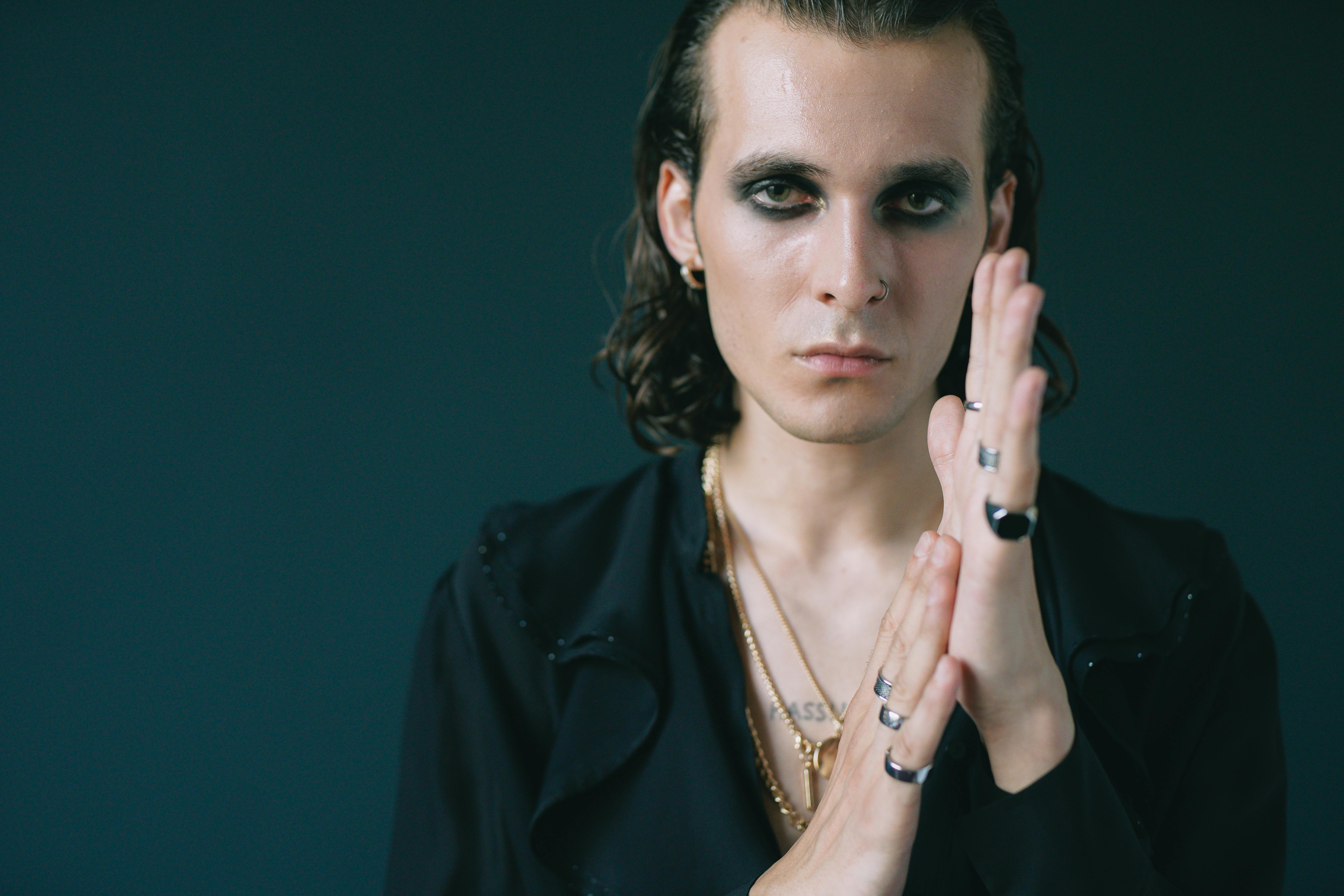 Metrosexual man with dark makeup · Free Stock Photo