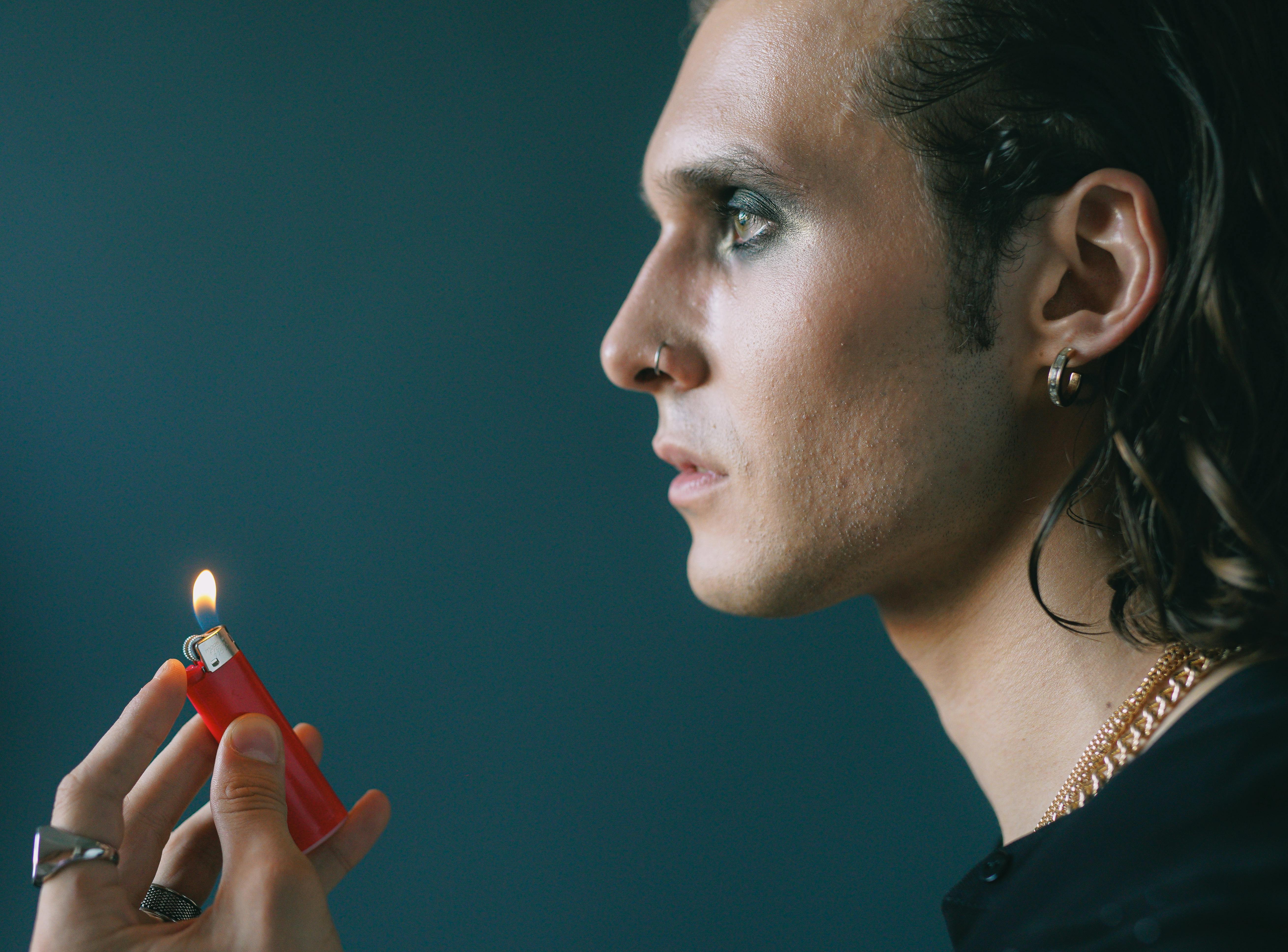 Man Holding a Lighter · Free Stock Photo